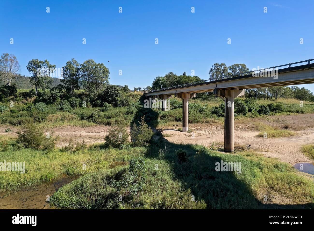 Aerial landscape along the edge of a bridge across a rural creek Stock ...
