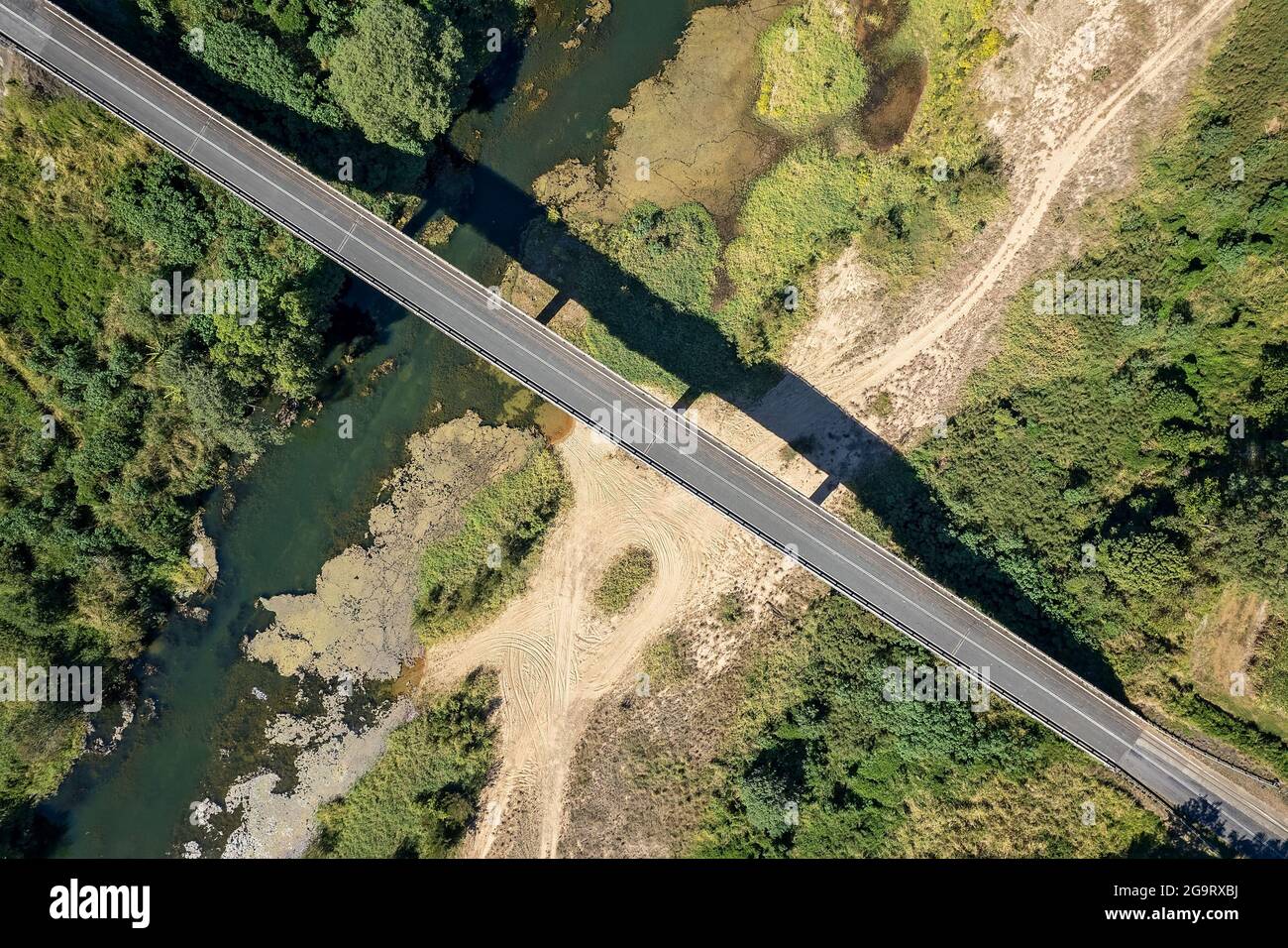 High aerial landscape of a highway bridge over a country creek ...