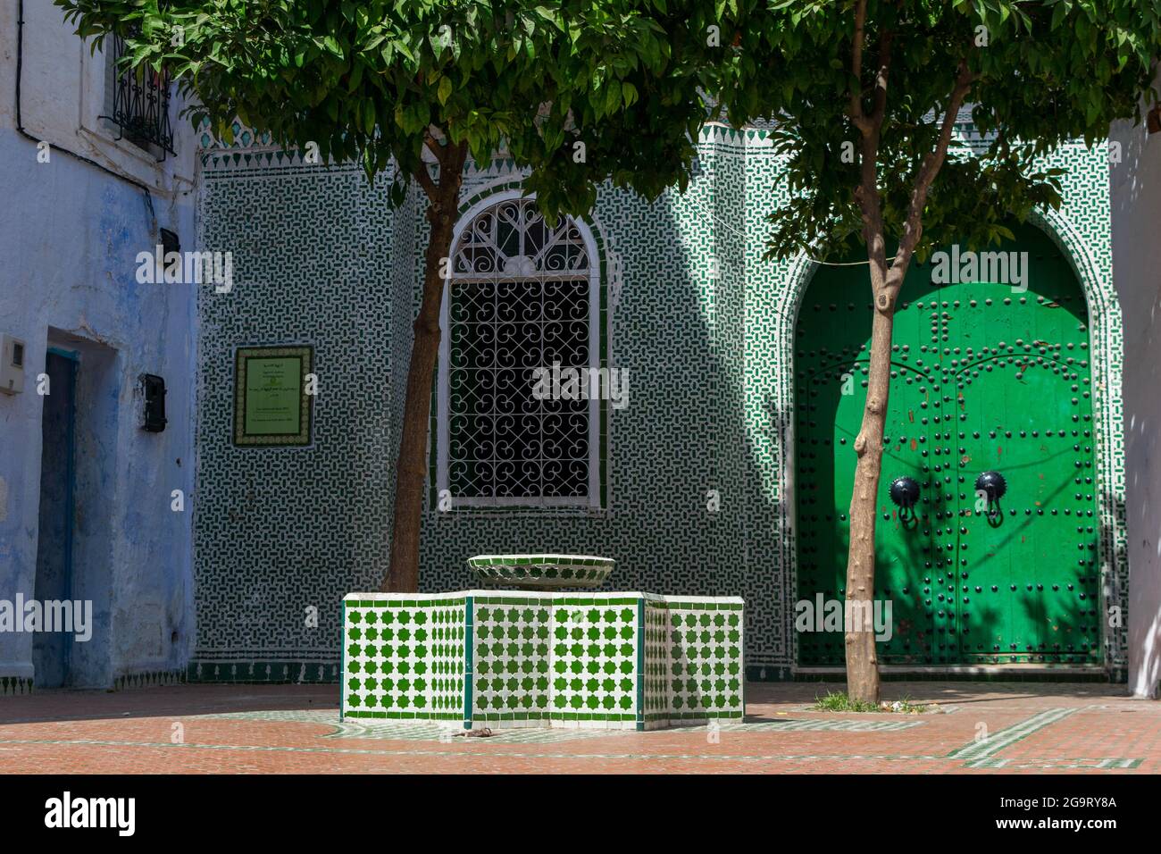 CHEFCHAOUEN, MOROCCO - Aug 31, 2018: A building facade covered in green ...