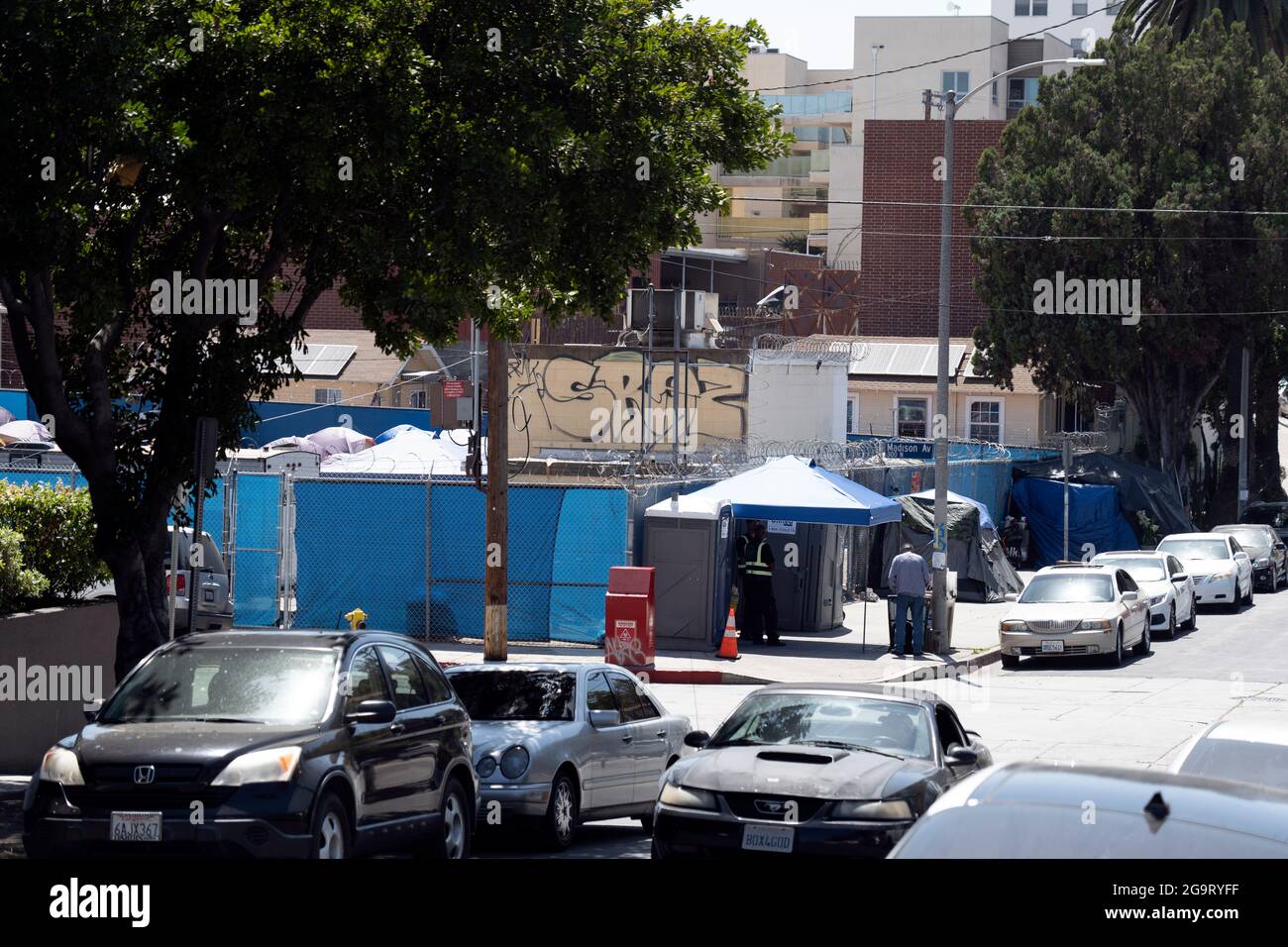Los Angeles, CA USA - May 27 , 2021: Tents inside a fenced in homeless ...