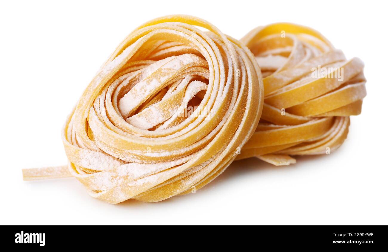 Pasta tagliatelle nests isolated on white Stock Photo - Alamy