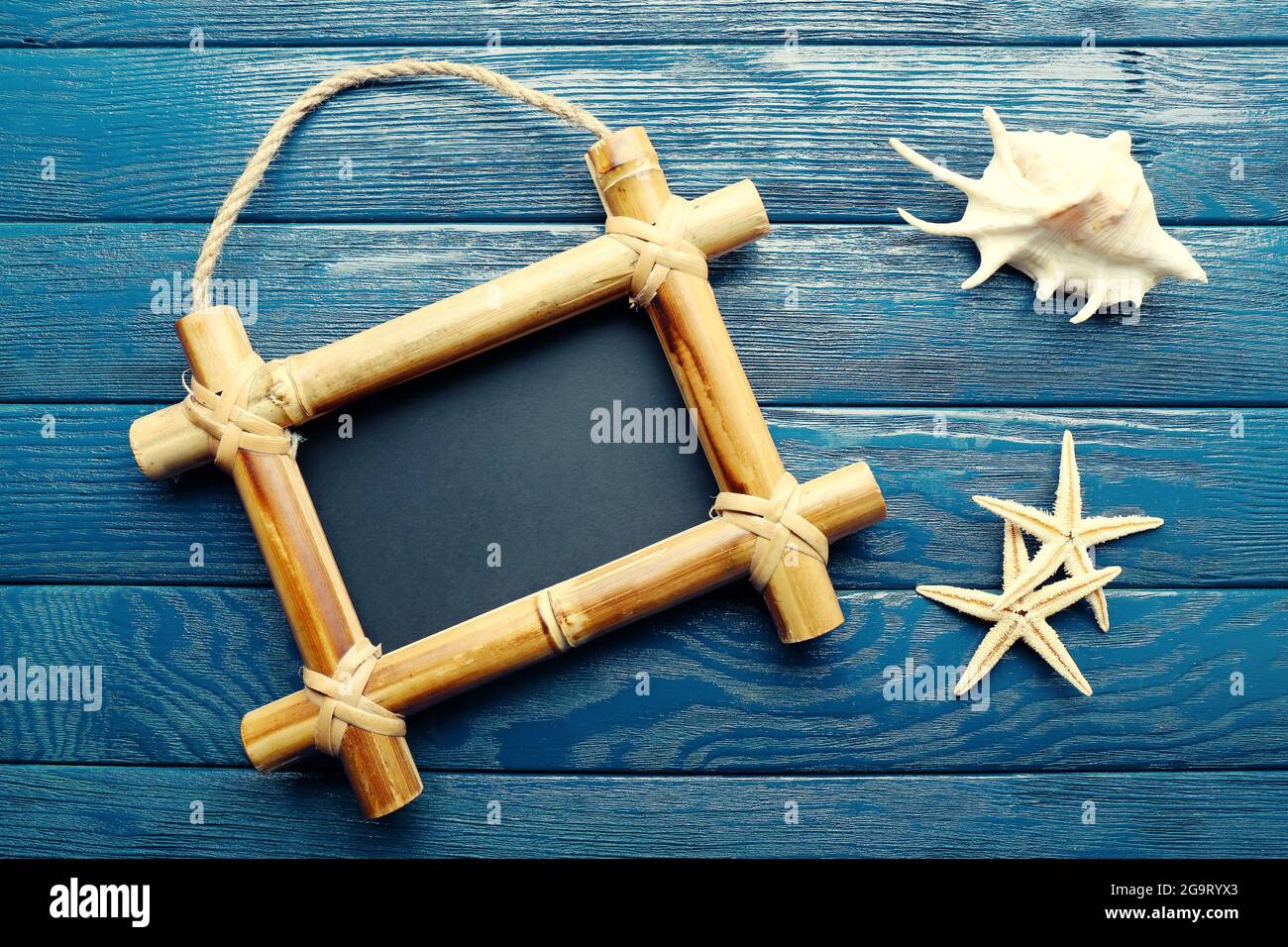 Sign board with shell and sea stars on wooden background Stock Photo ...