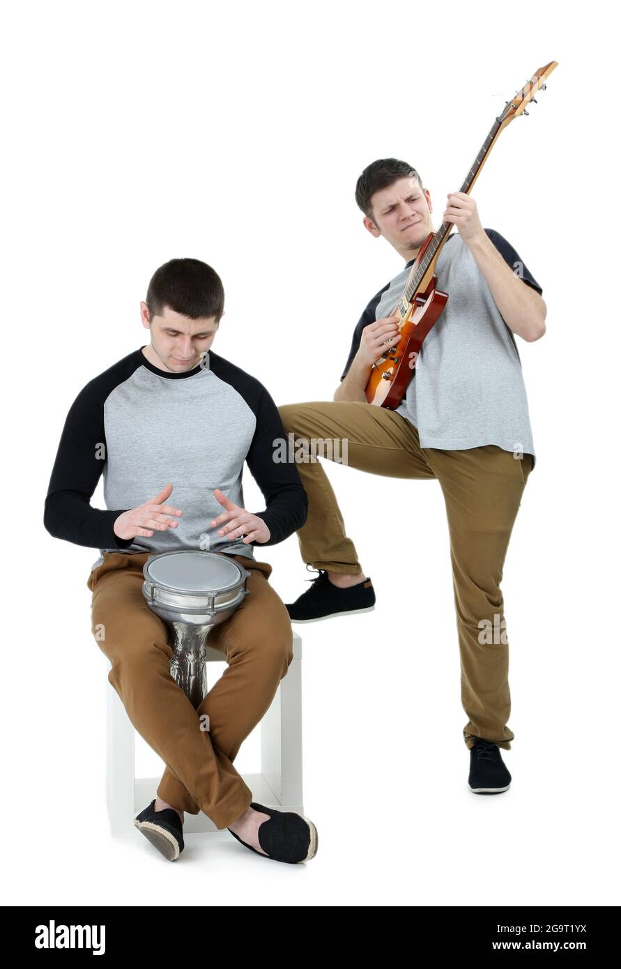 Two handsome young men with musical instruments isolated on white Stock ...