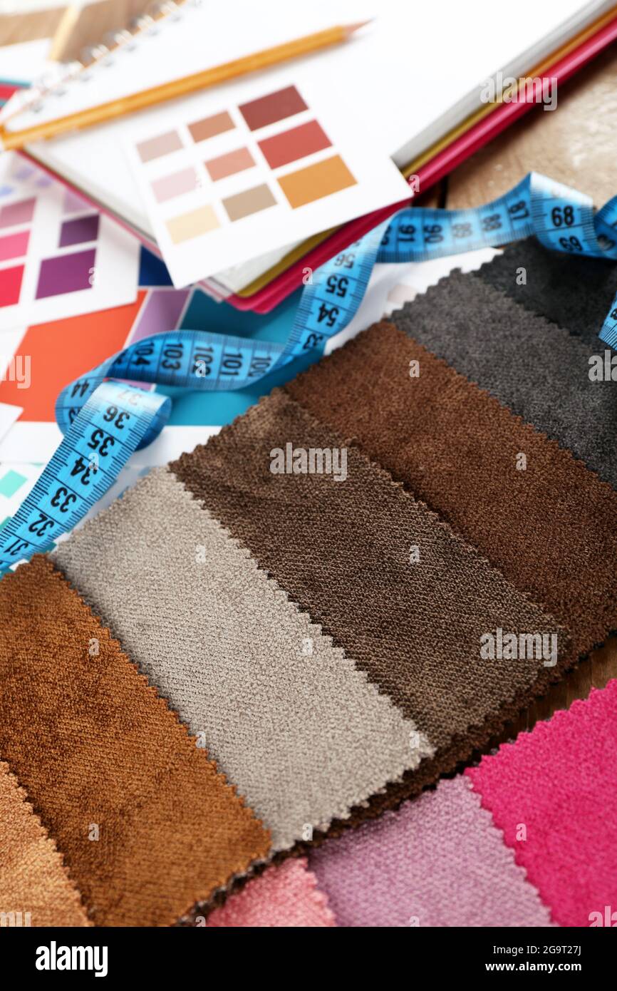 Scraps of colored tissue with palette and measuring tape close up Stock ...