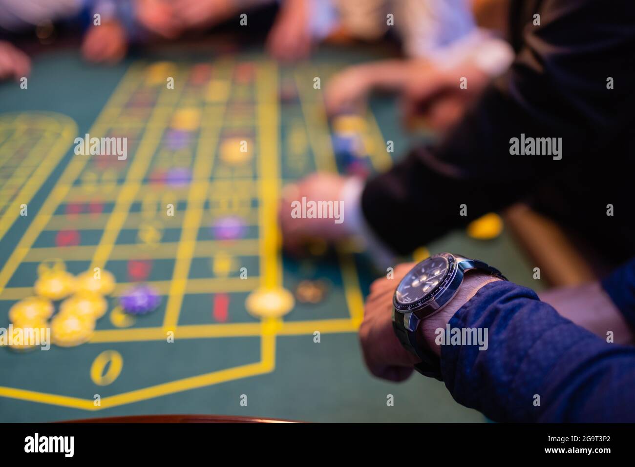 A close up of a blackjack dealer's hands in a casino, very shallow ...