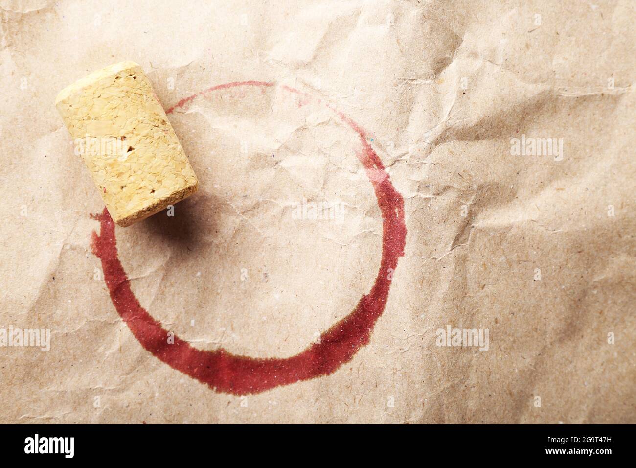 Wine stain and cork on crumpled paper background Stock Photo - Alamy