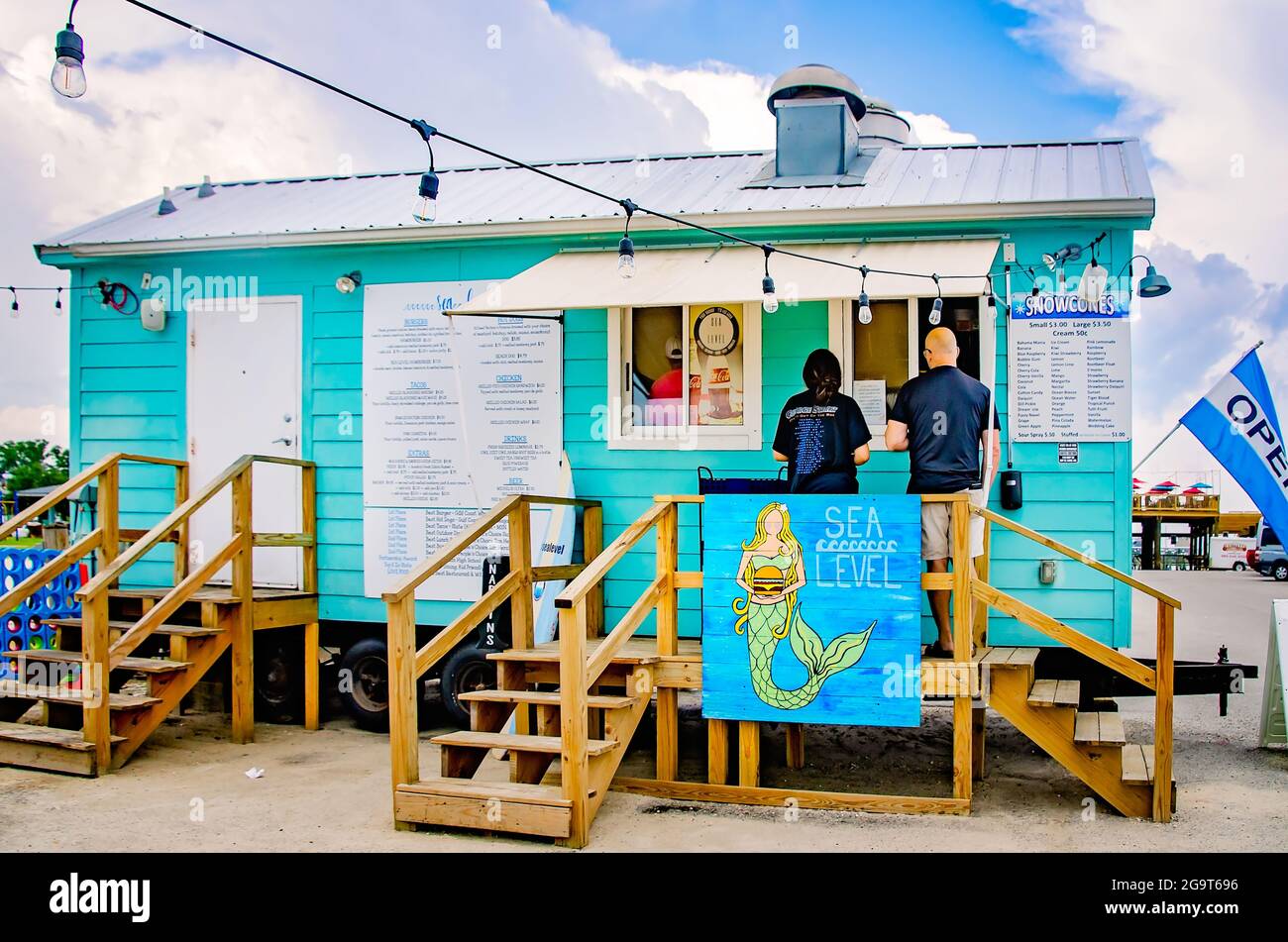 Customers wait in line at Sea Level food stand, July 24, 2021, in Pass ...