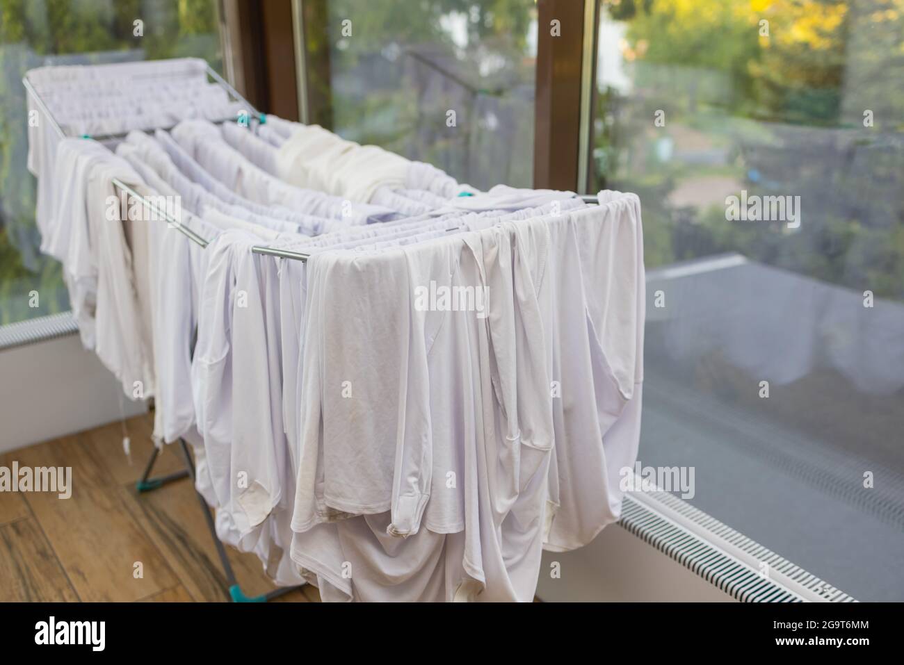 Laundry Drying clothes outdoors with Sun at the Balcony condominium ...