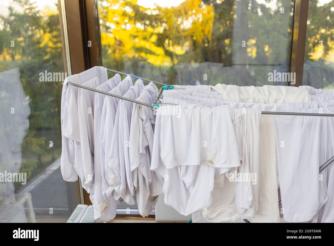 Laundry Drying clothes outdoors with Sun at the Balcony condominium ...