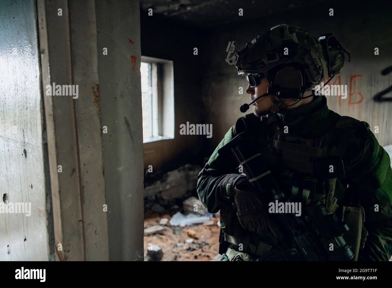 Military men with arms defending the building. Soldier stand guard ...