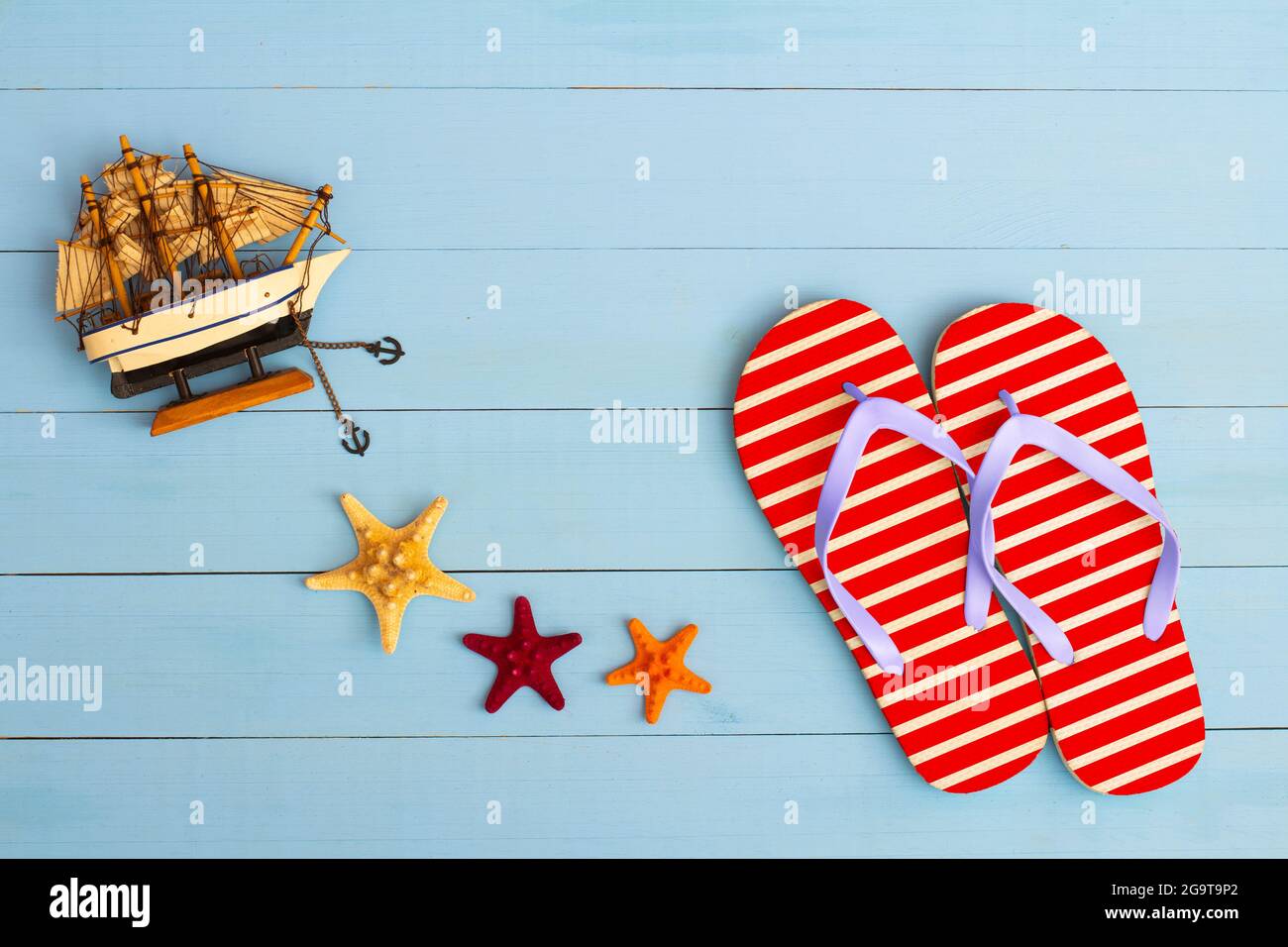 Summer time on a cool view on painted light blue wood table with ...