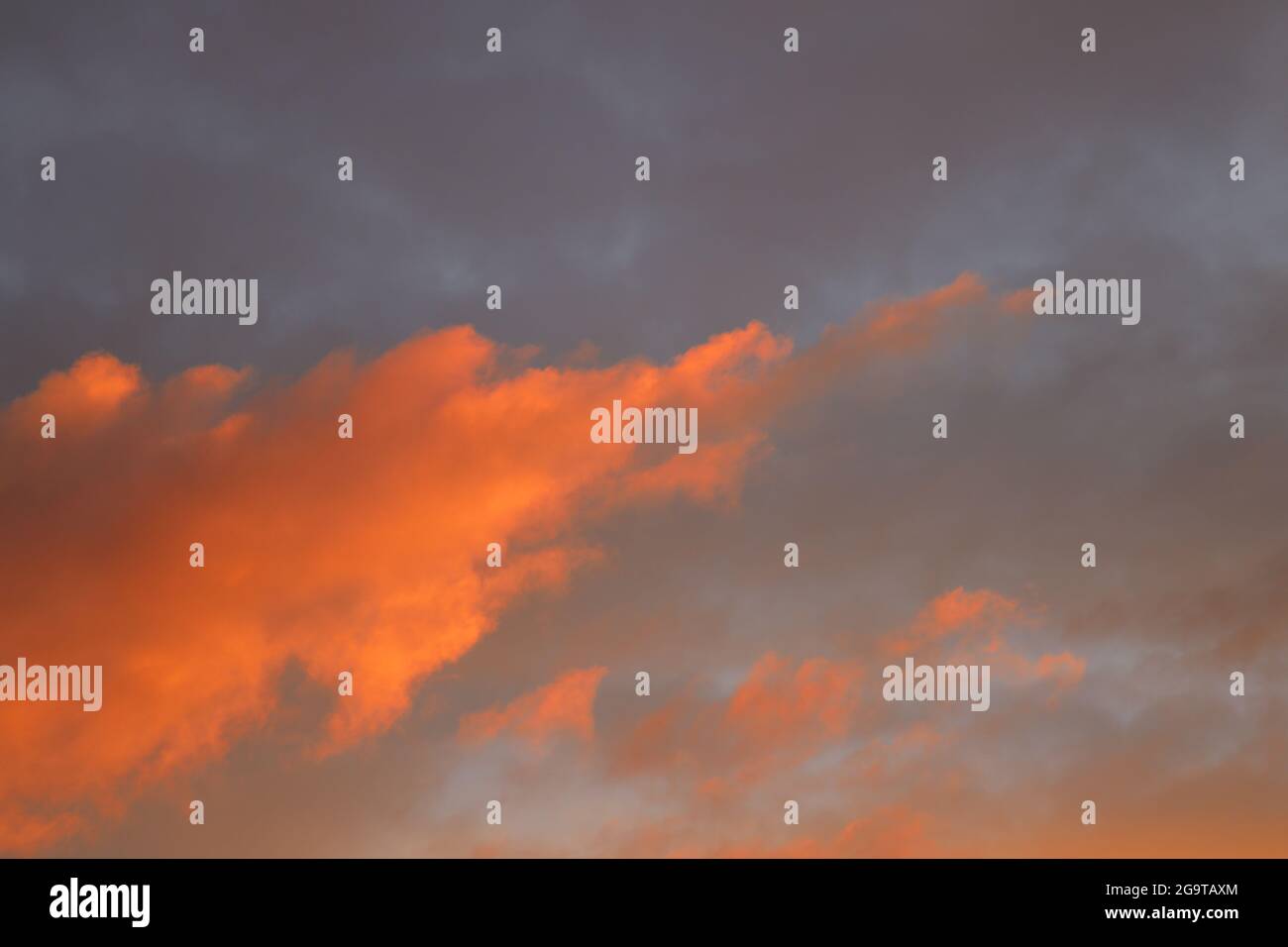 sky at sunset. clouds of orange. nature illuminated by the setting sun ...