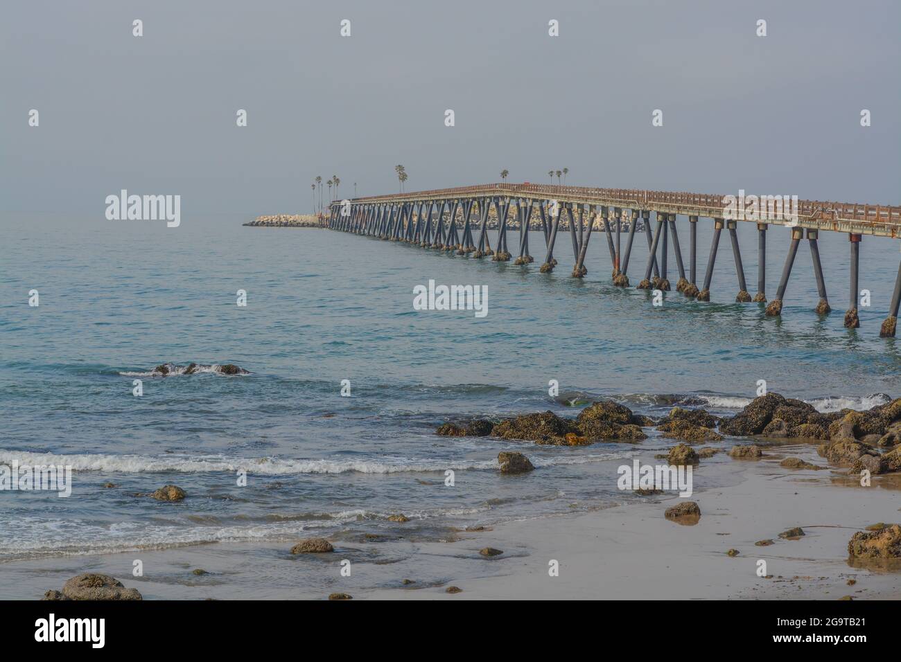 View of Richfield Pier out to Rincon Island on the Pacific Ocean. In ...