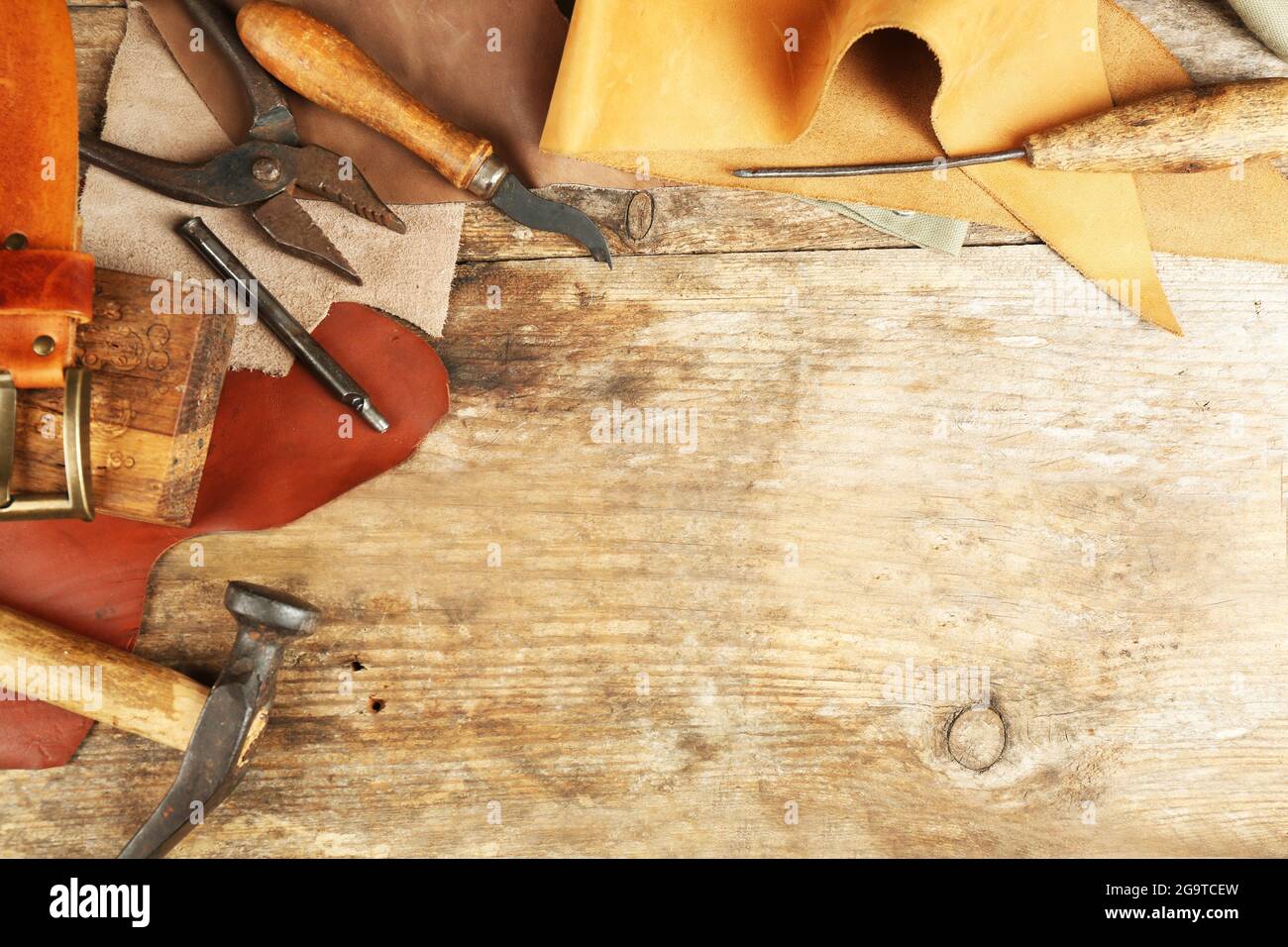 Leather and craft tools on wooden background Stock Photo - Alamy