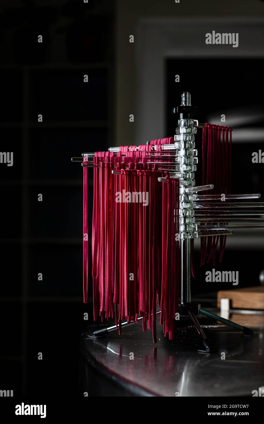 Red ribbon hanging on the crystal rack Stock Photo - Alamy