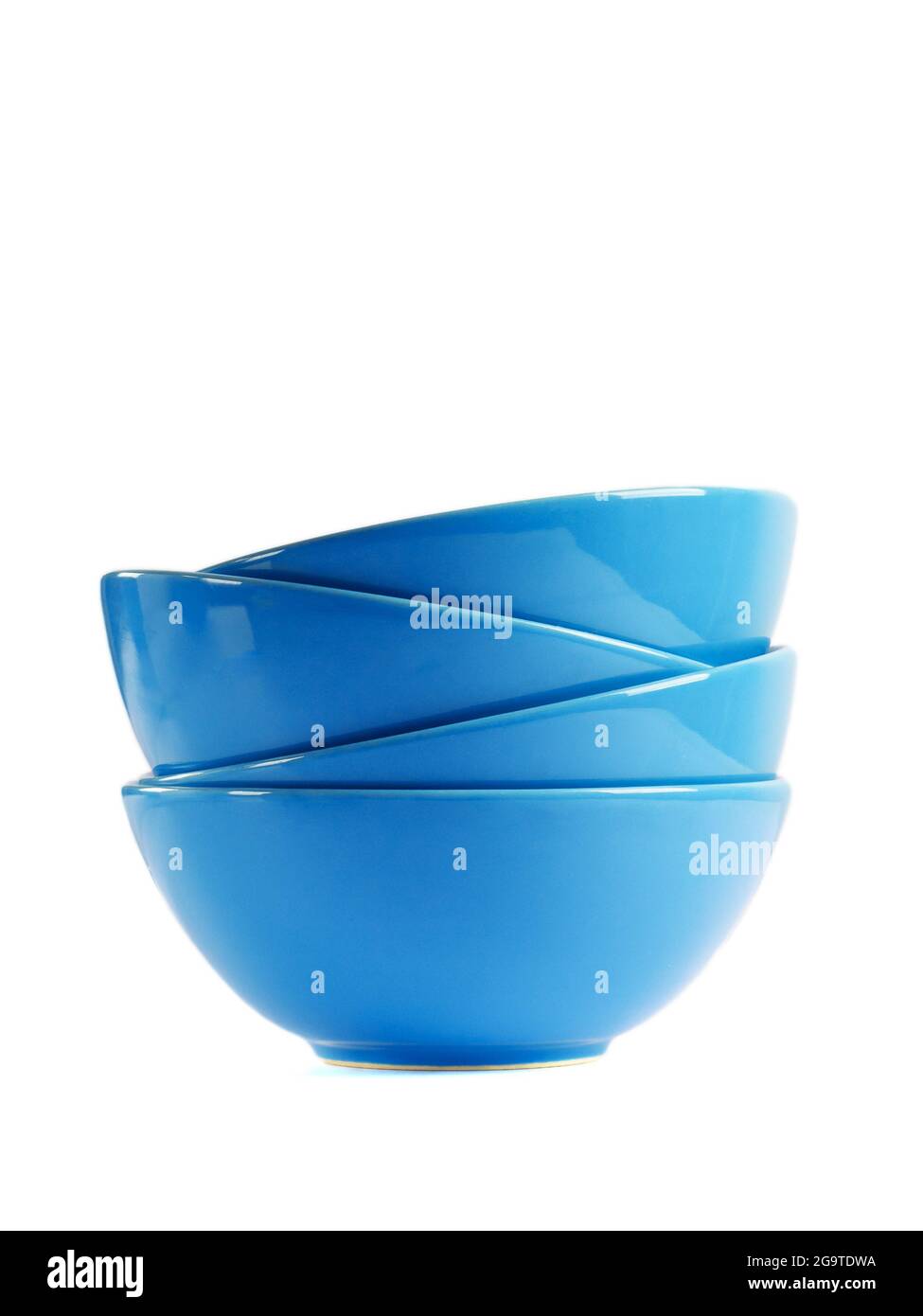 Stack of four blue ceramic bowls isolated on white Stock Photo - Alamy
