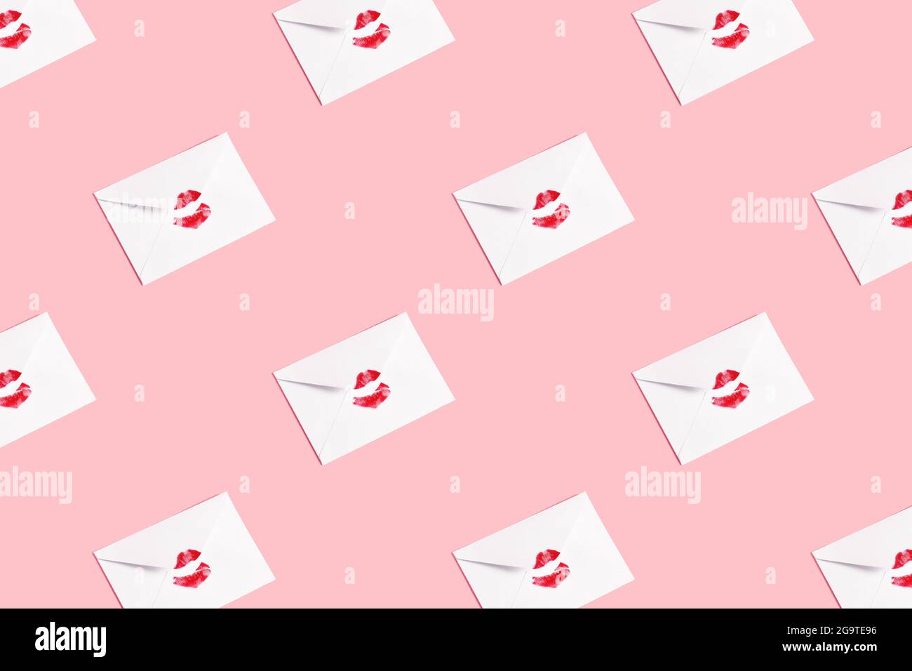 Red lipstick kiss on white envelope on pink pastel background. Minimal ...