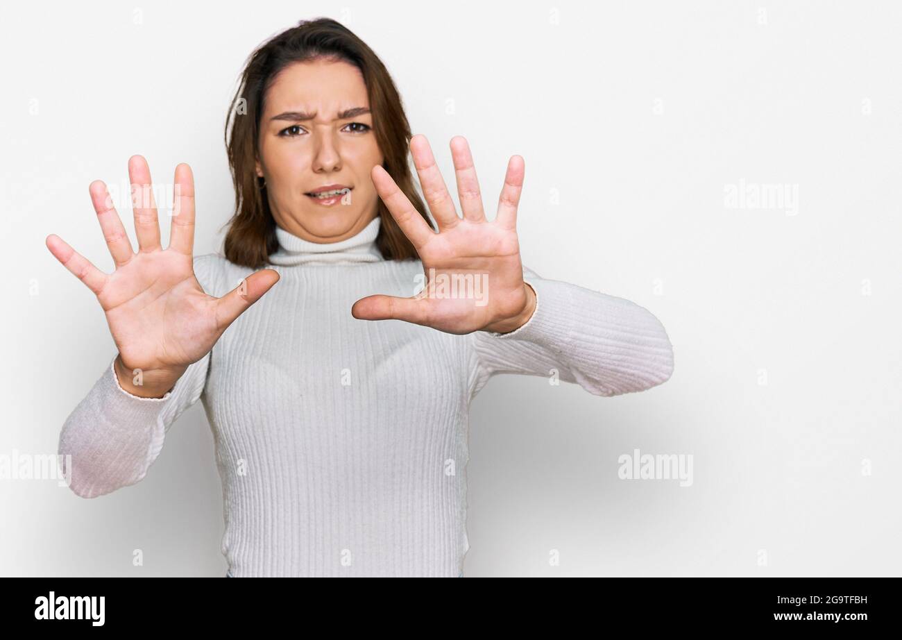 Young caucasian girl wearing casual clothes afraid and terrified with ...