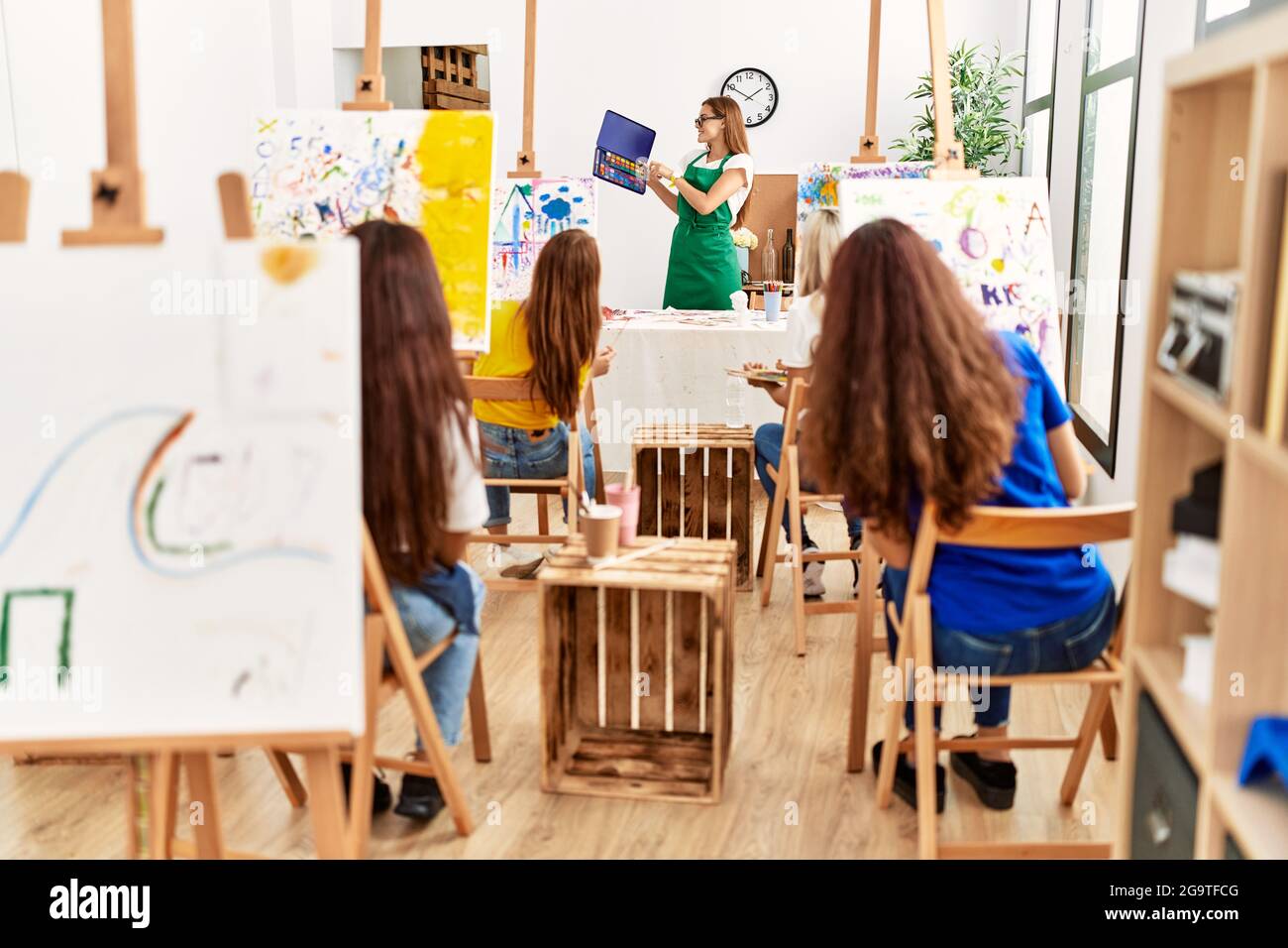 Group of young artist girls having draw lesson at art studio Stock ...