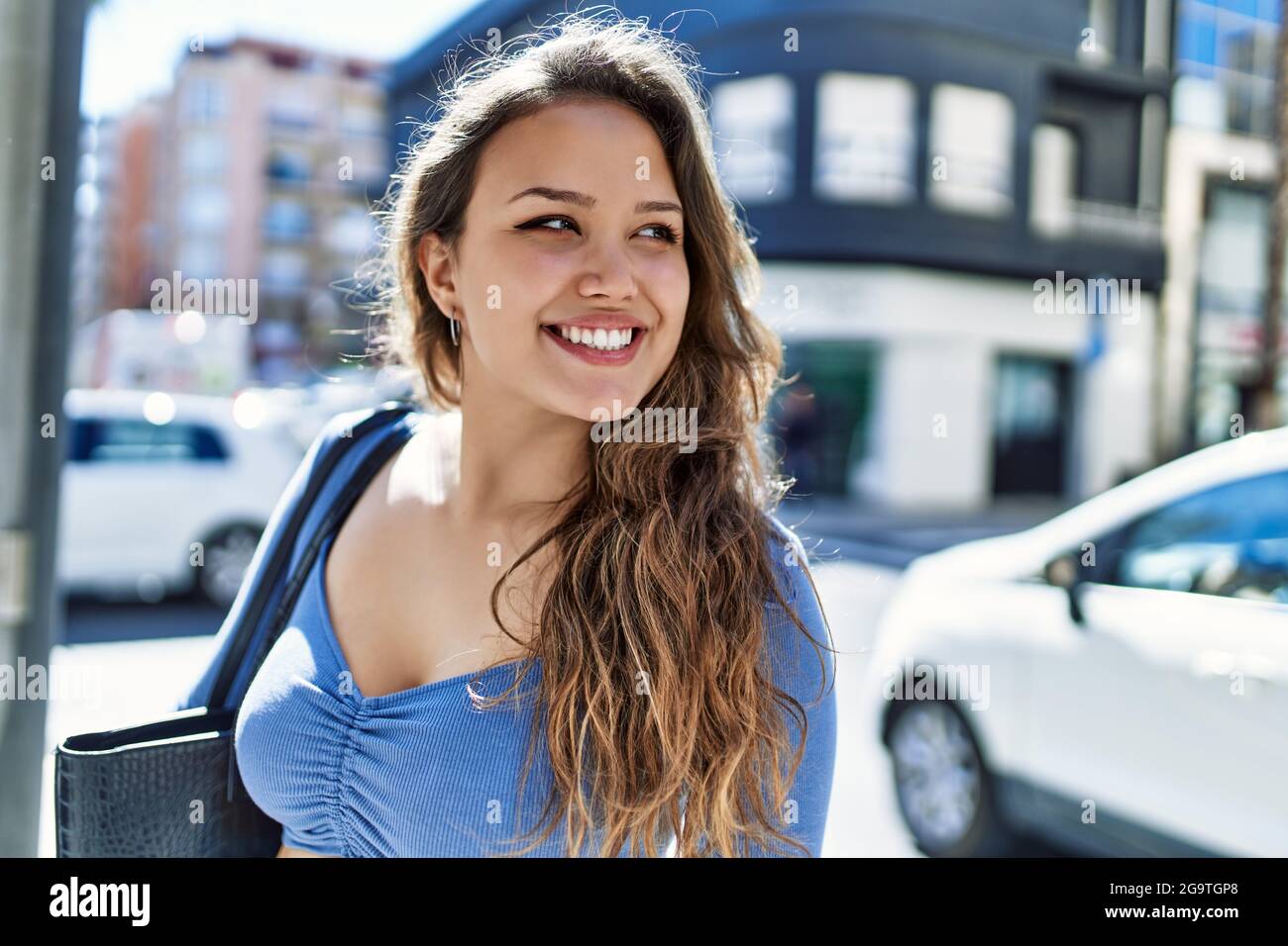 young hispanic girl smiling happy standing at the city Stock Photo - Alamy