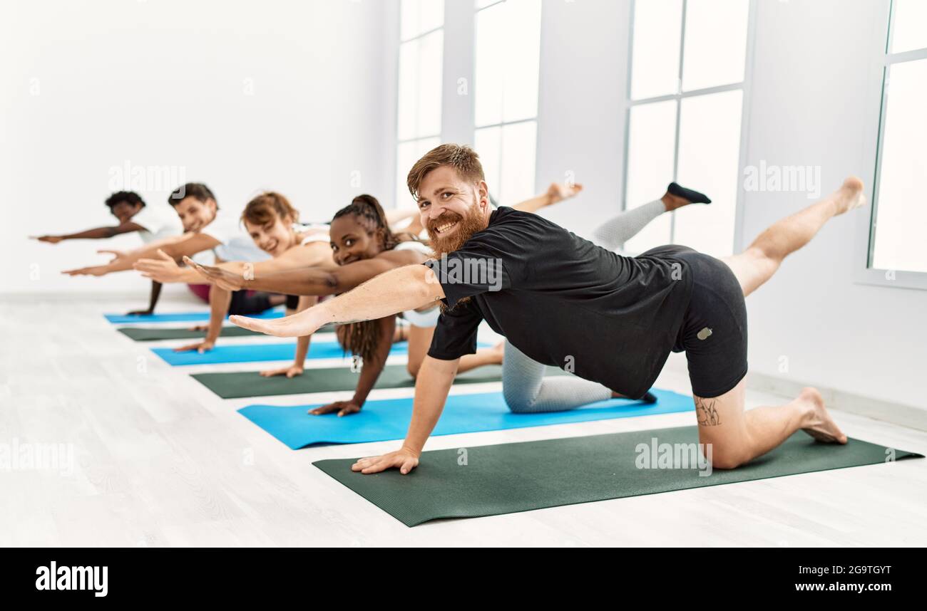 Group of young people smiling happy stretching at sport center Stock ...