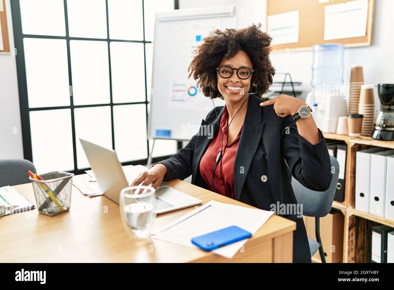 African american woman with afro hair working at the office wearing ...