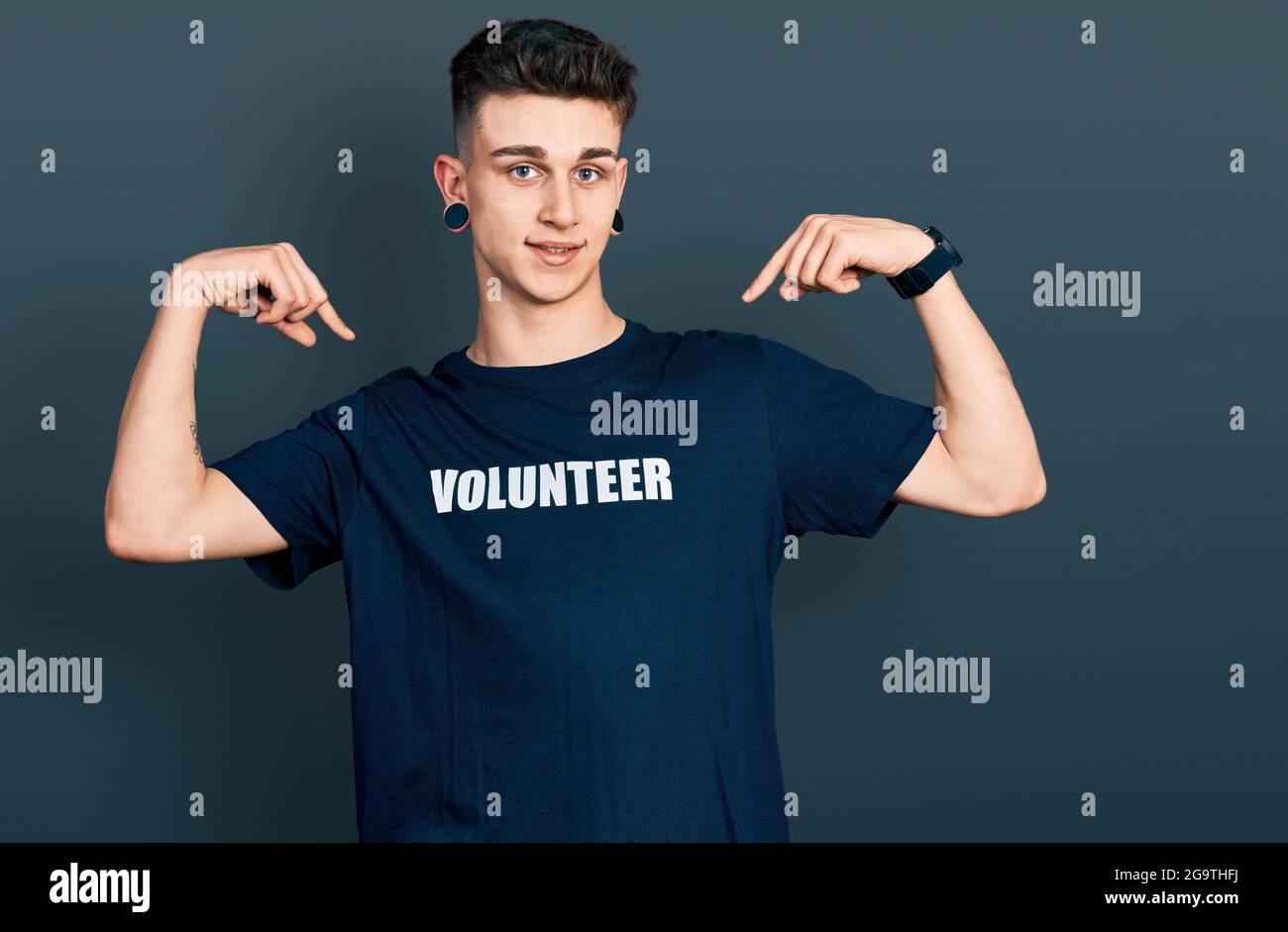 Young caucasian boy with ears dilation wearing volunteer t shirt ...