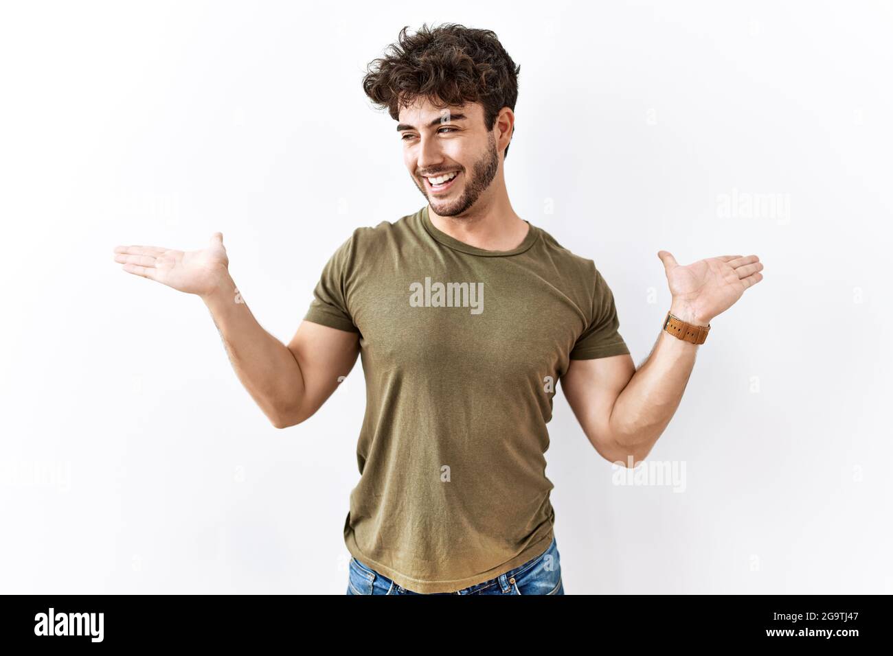 Hispanic man standing over isolated white background smiling showing ...