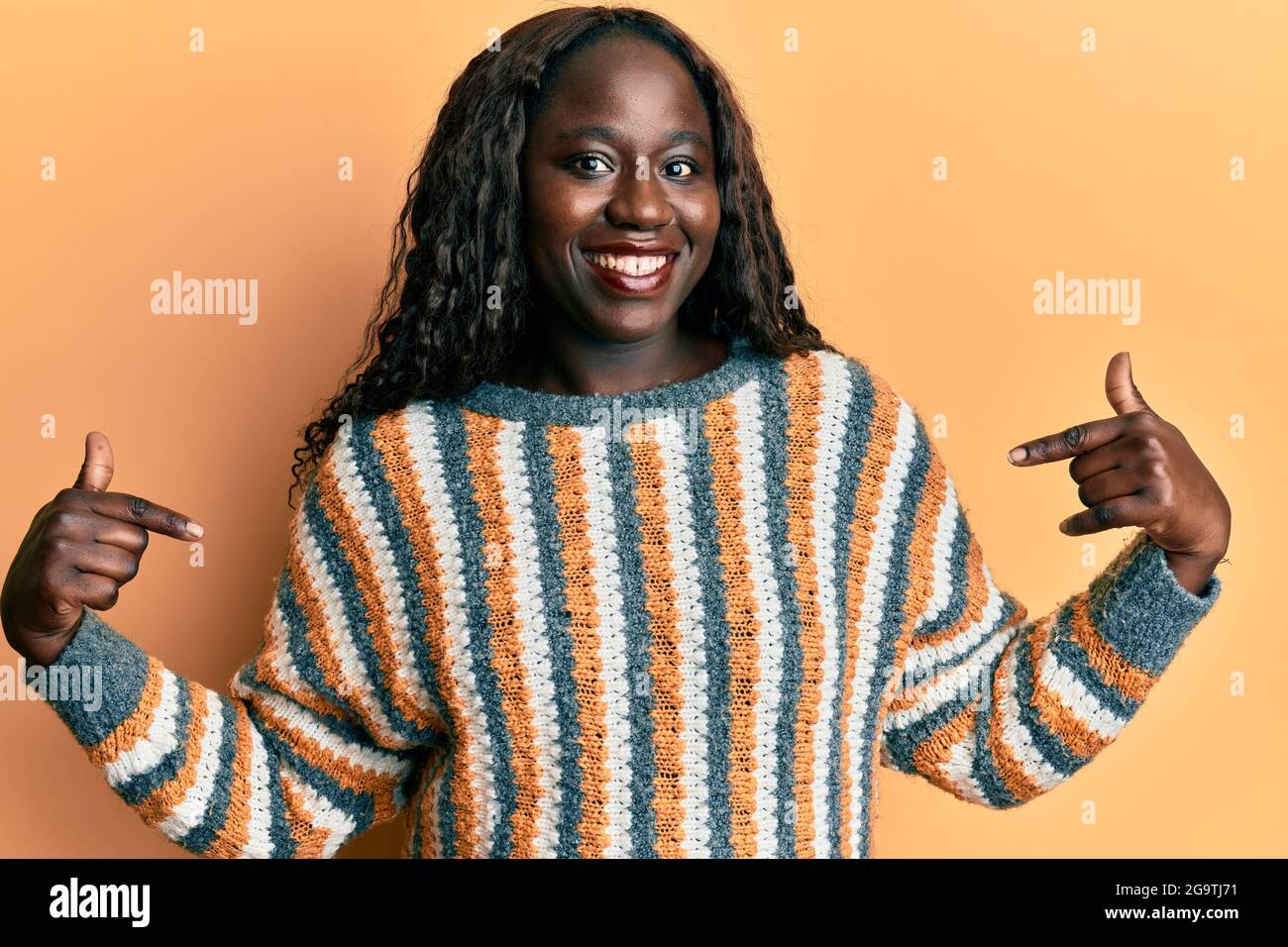 African young woman wearing wool winter sweater looking confident with ...