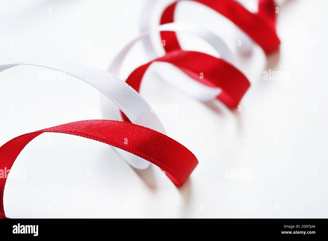 Colorful ribbons isolated on white Stock Photo - Alamy