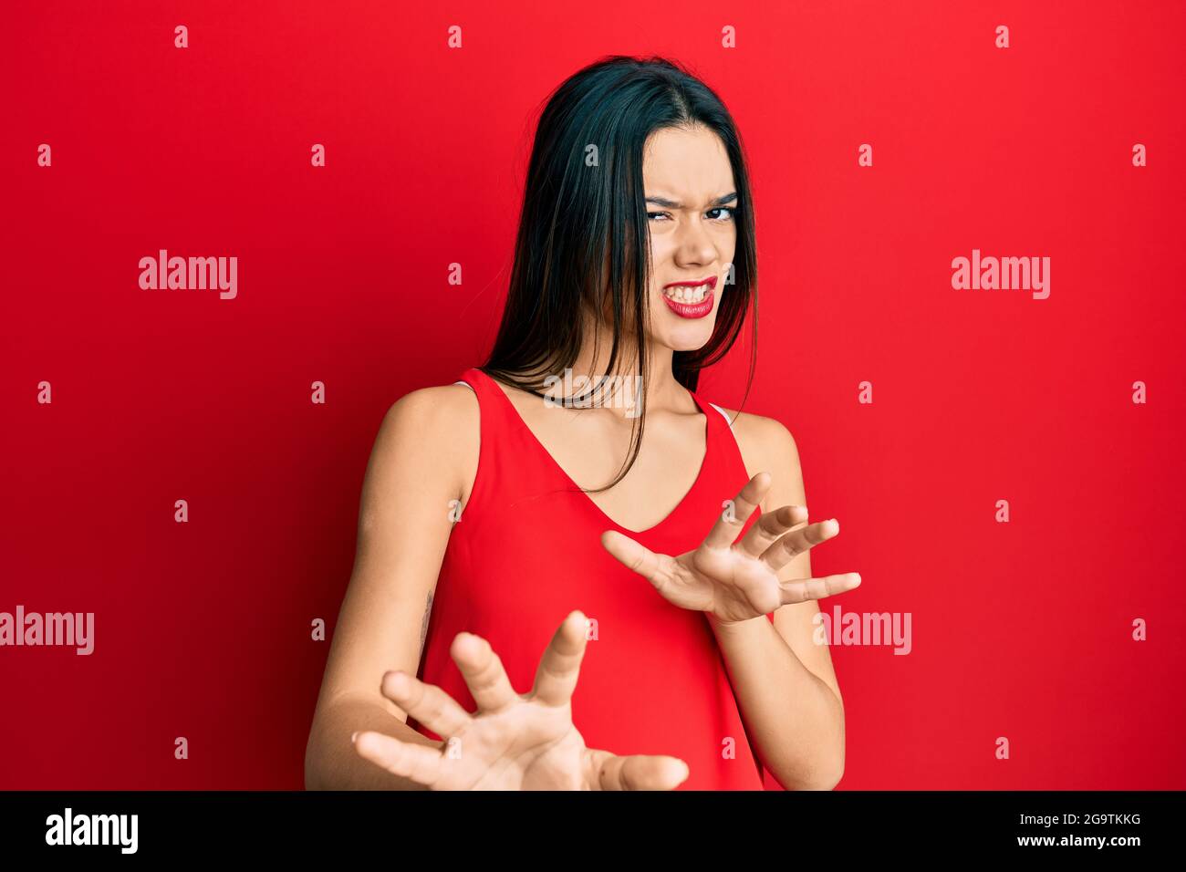 Young hispanic girl wearing casual style with sleeveless shirt ...