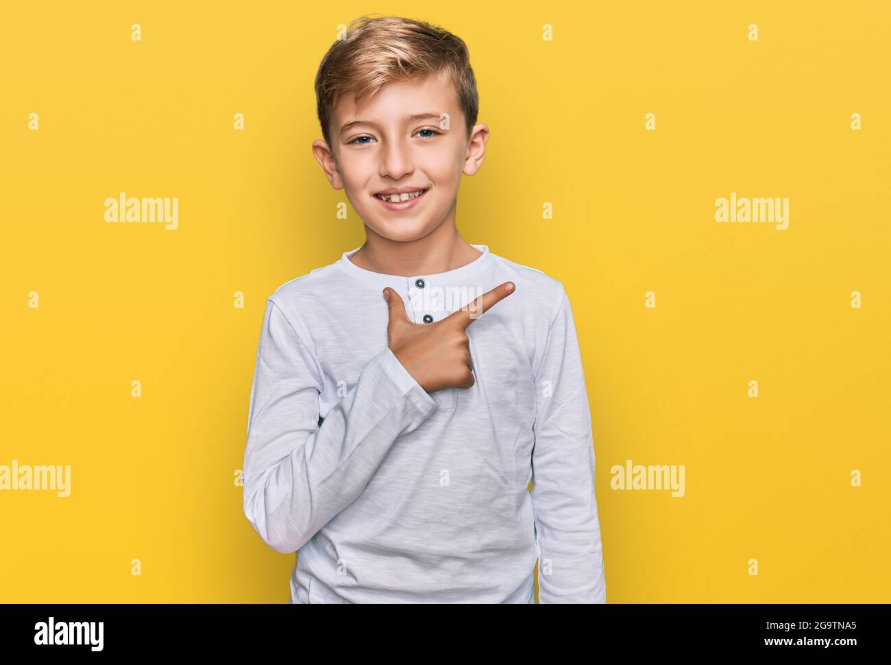 Little caucasian boy kid wearing casual clothes cheerful with a smile ...