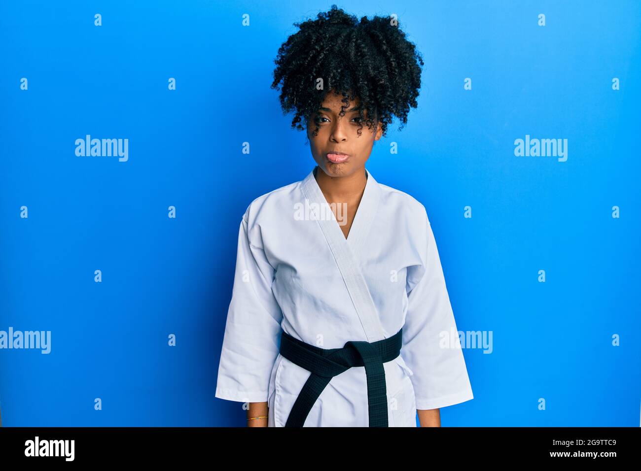 African american woman with afro hair wearing karate kimono and black ...