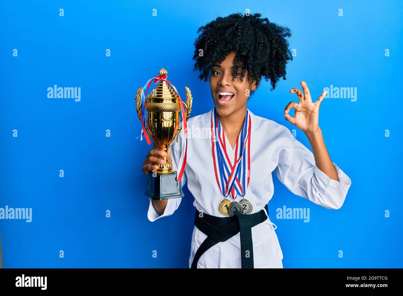 African american woman with afro hair wearing karate kimono and black ...