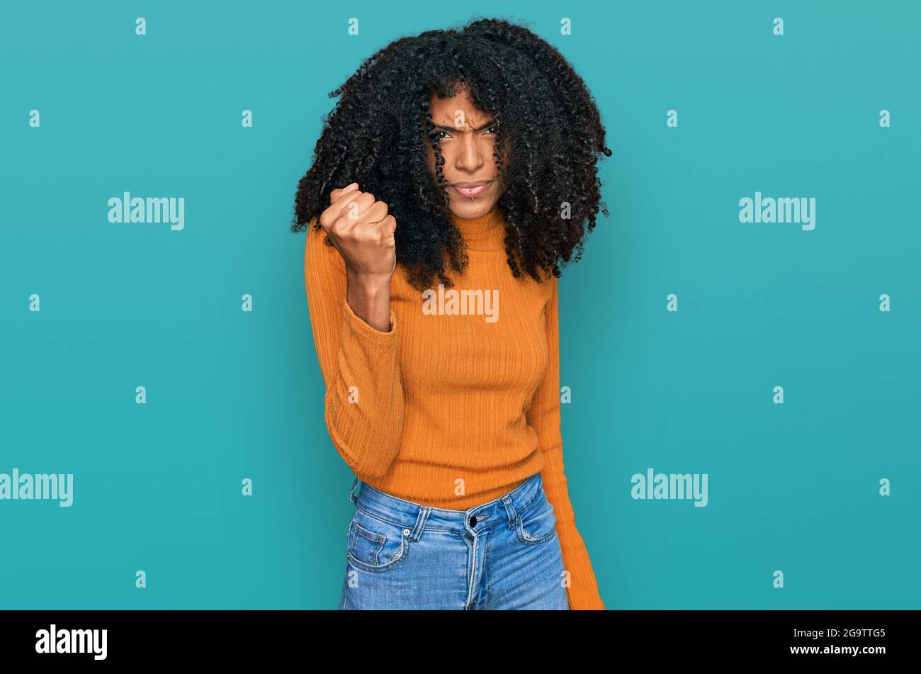 Young african american girl wearing casual clothes angry and mad ...