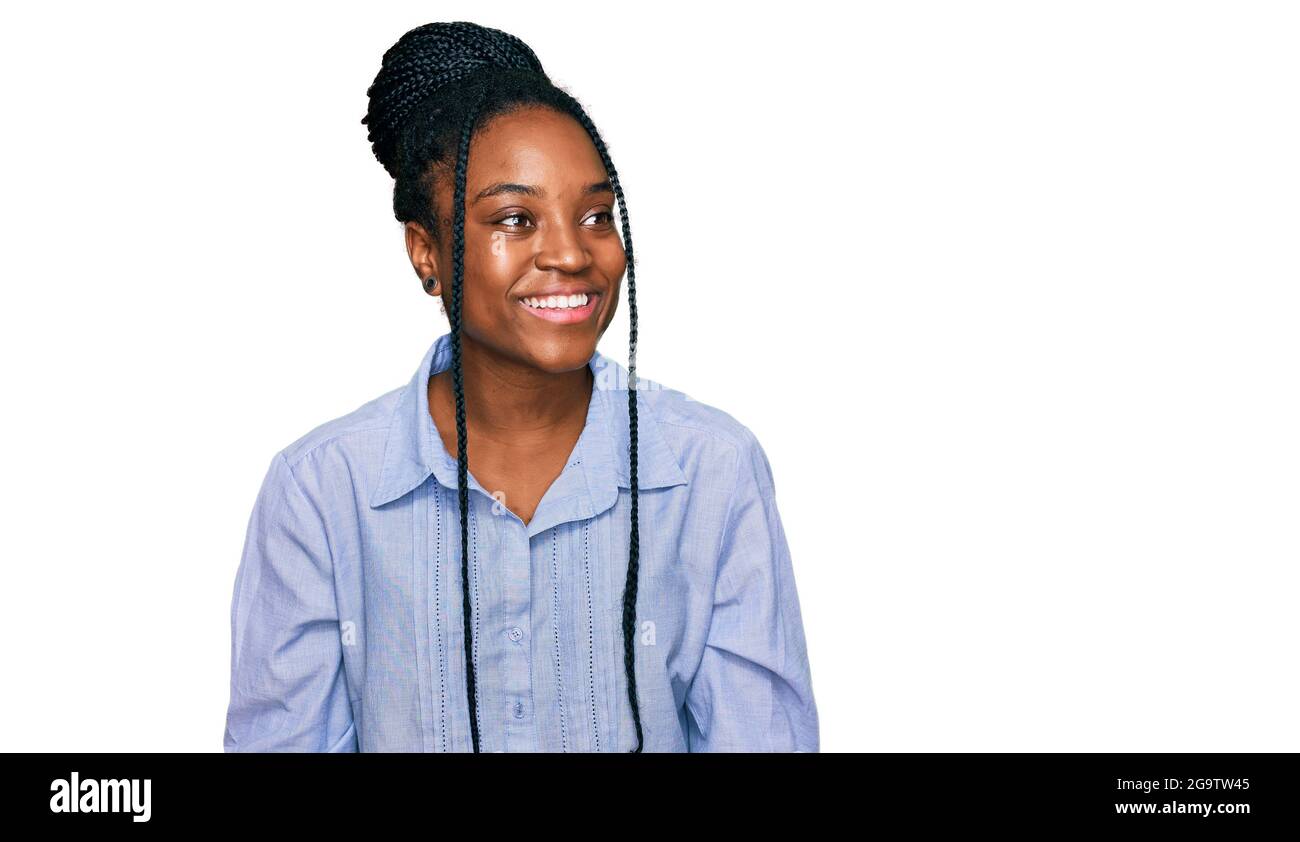 Young african american woman wearing casual clothes looking away to ...