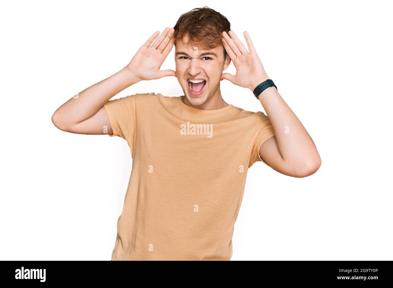 Young caucasian man wearing casual clothes smiling cheerful playing ...