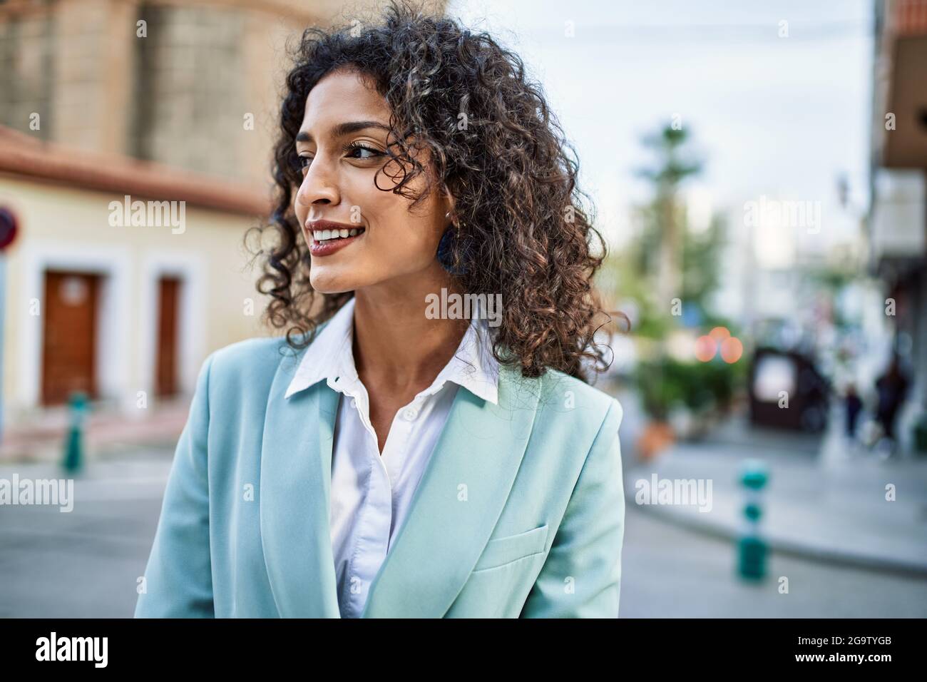 Young hispanic business woman wearing professional look smiling ...