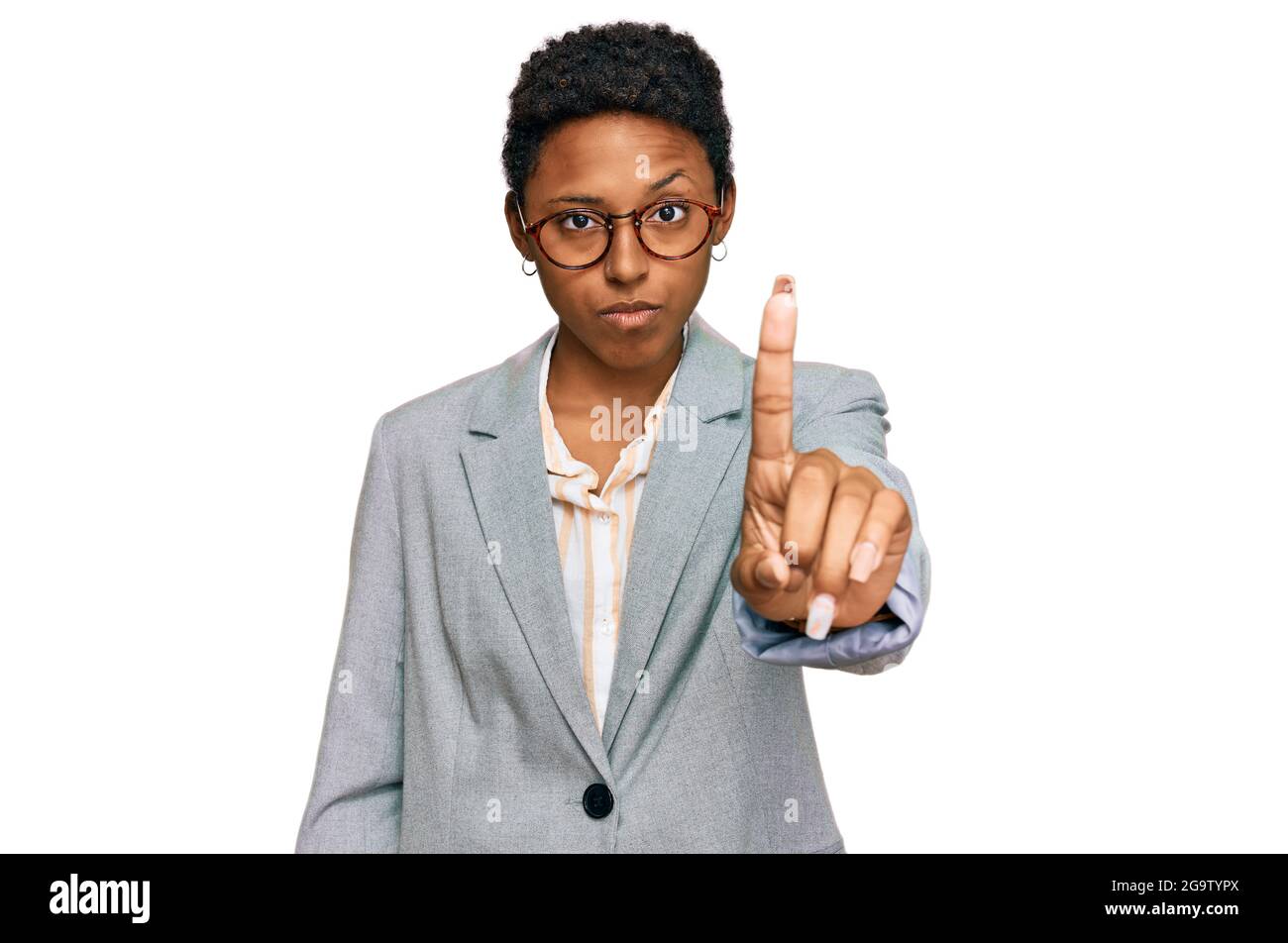 Young african american woman wearing business clothes pointing with ...