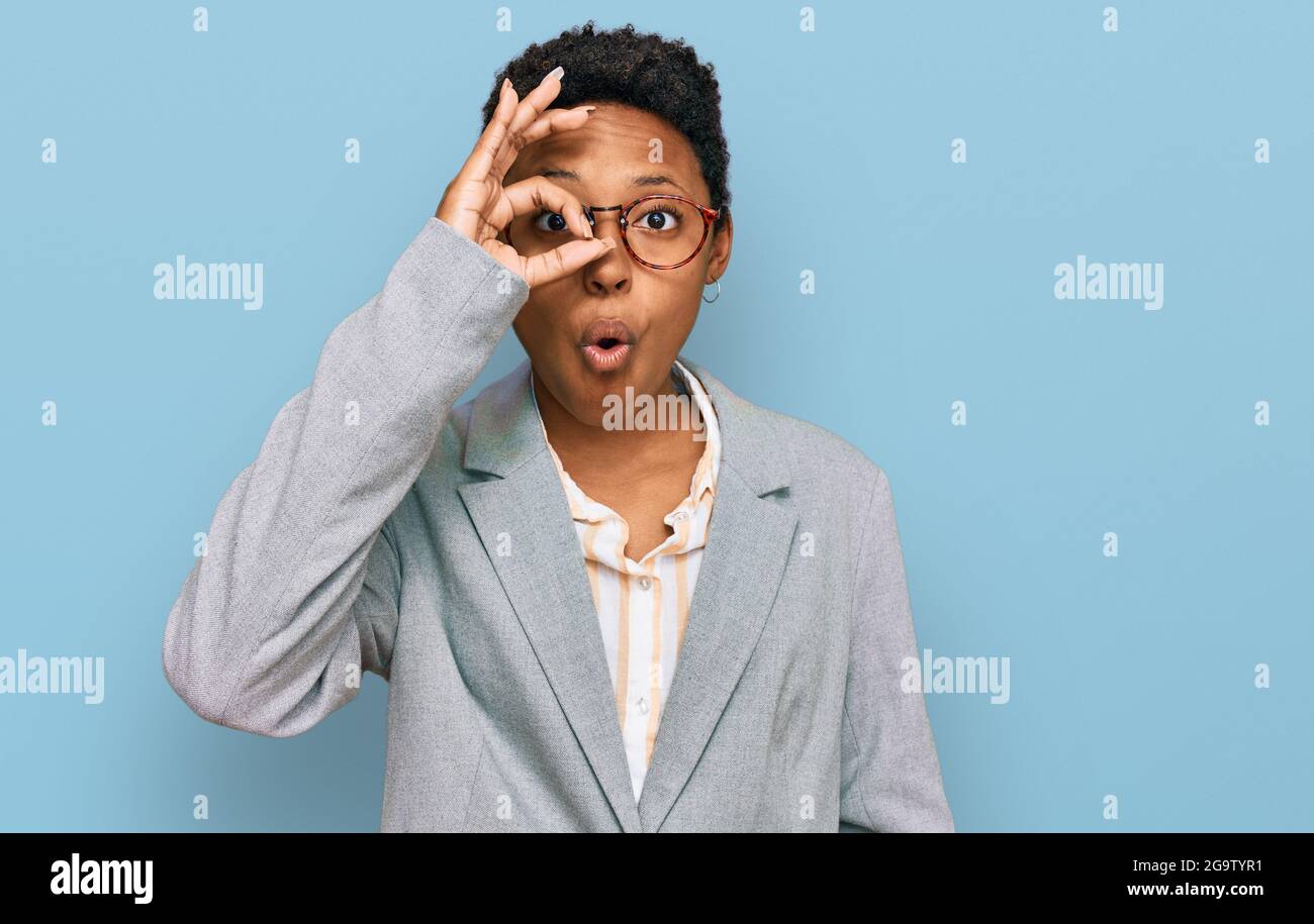 Young african american woman wearing business clothes doing ok gesture ...