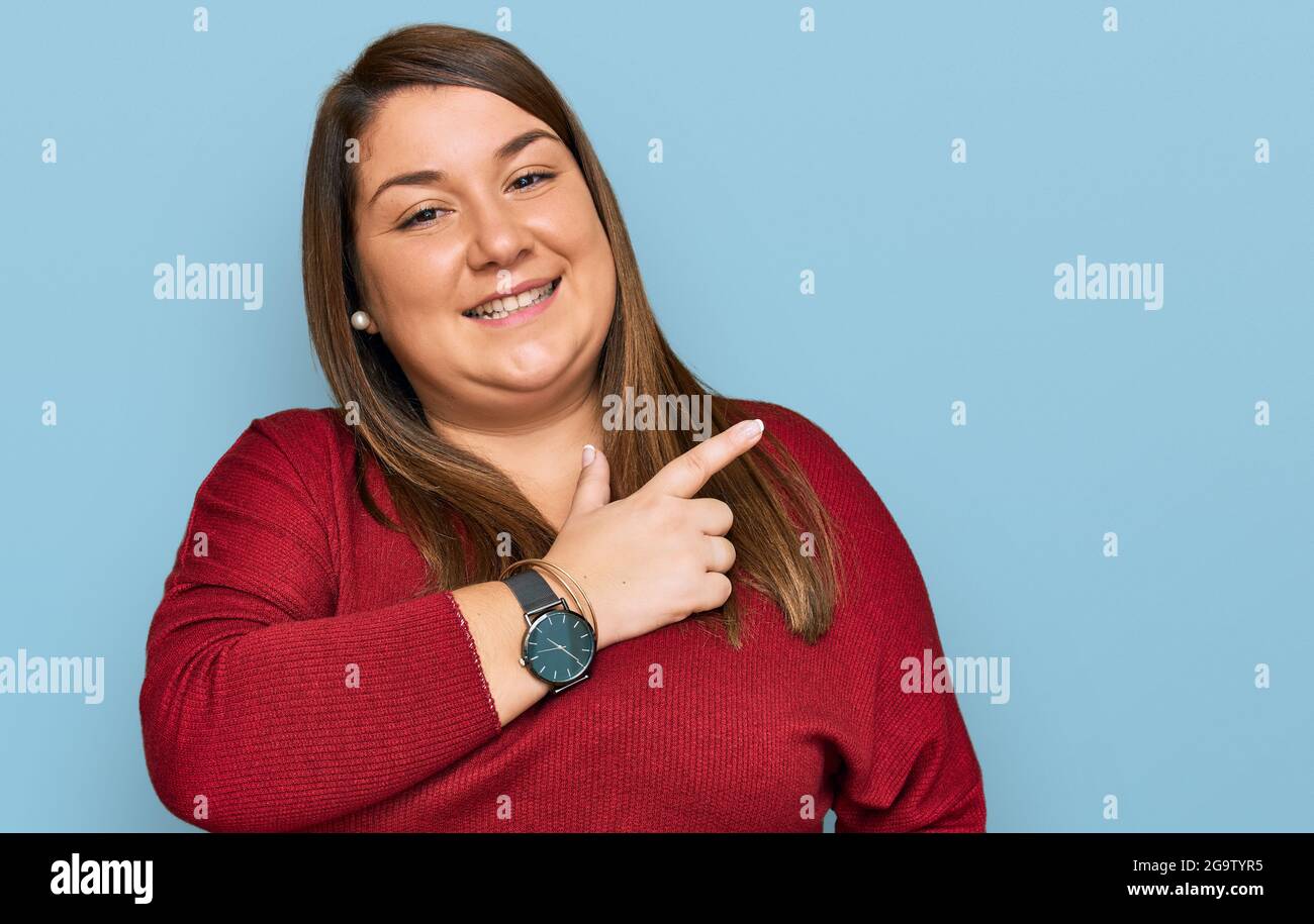 Beautiful brunette plus size woman wearing casual clothes cheerful with ...