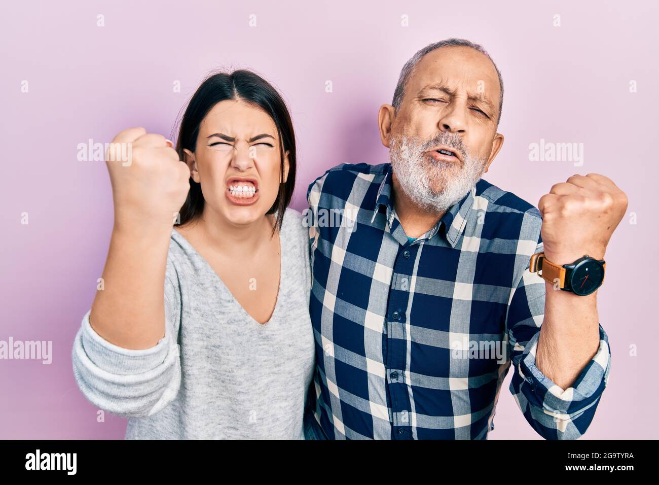 Hispanic father and daughter wearing casual clothes angry and mad ...