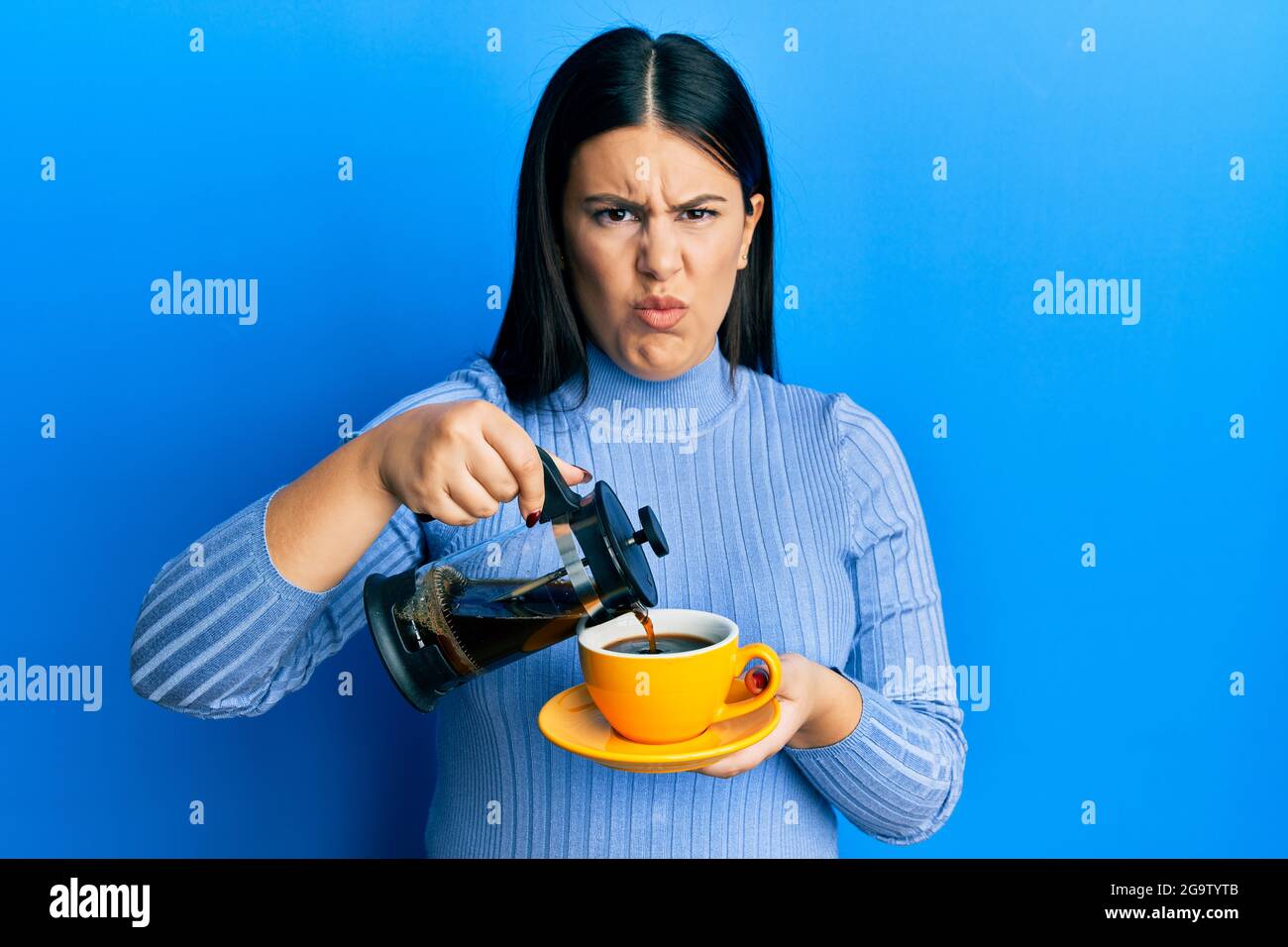Woman pouring coffee on head hi-res stock photography and images - Alamy