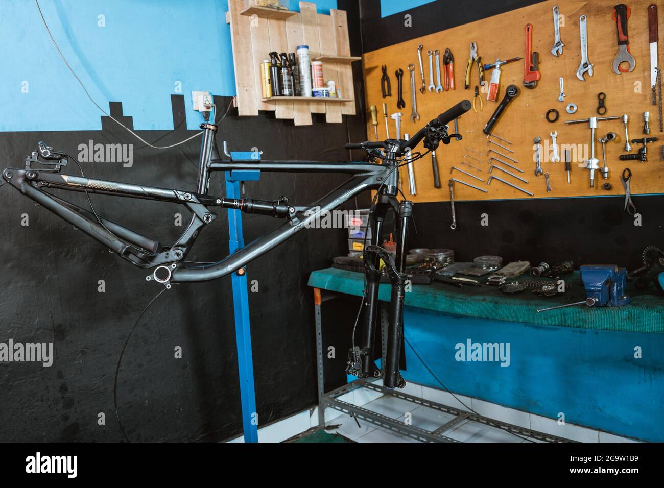 bicycle frame without hanging wheels will be repaired and installed in ...