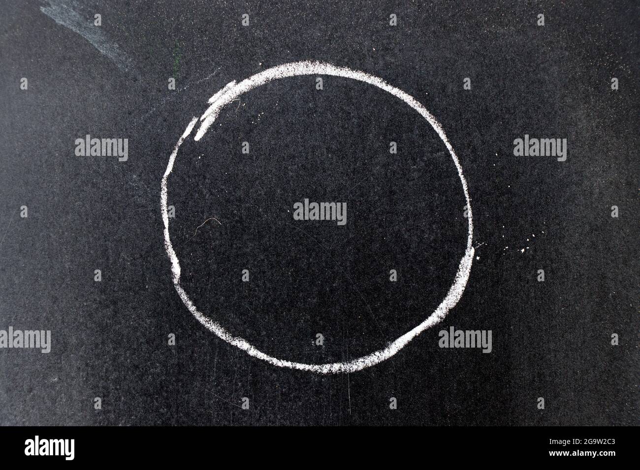 White chalk drawing in circle shape on black board background Stock ...