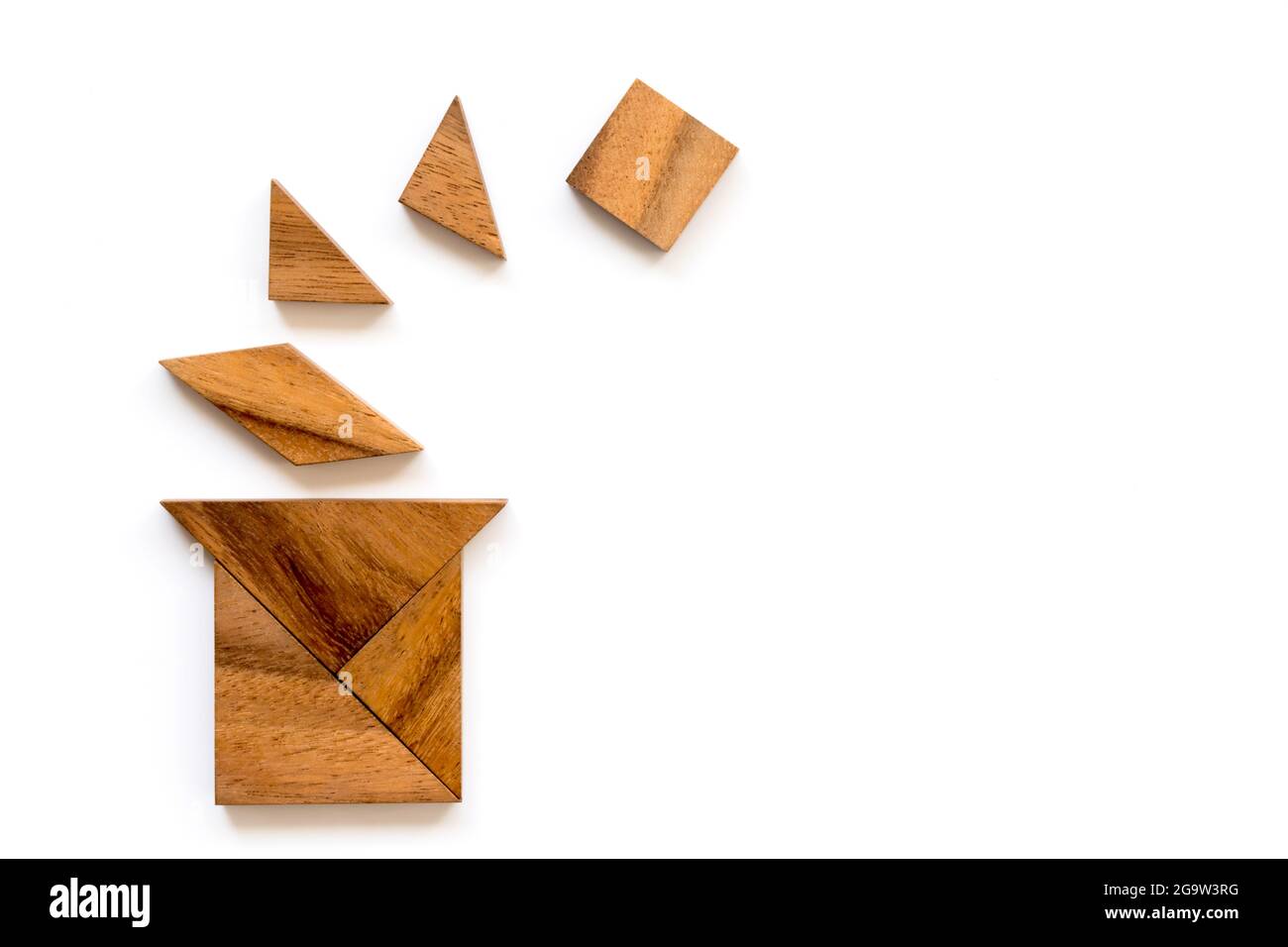 Wood tangram puzzle in magic hat shape on white background Stock Photo ...