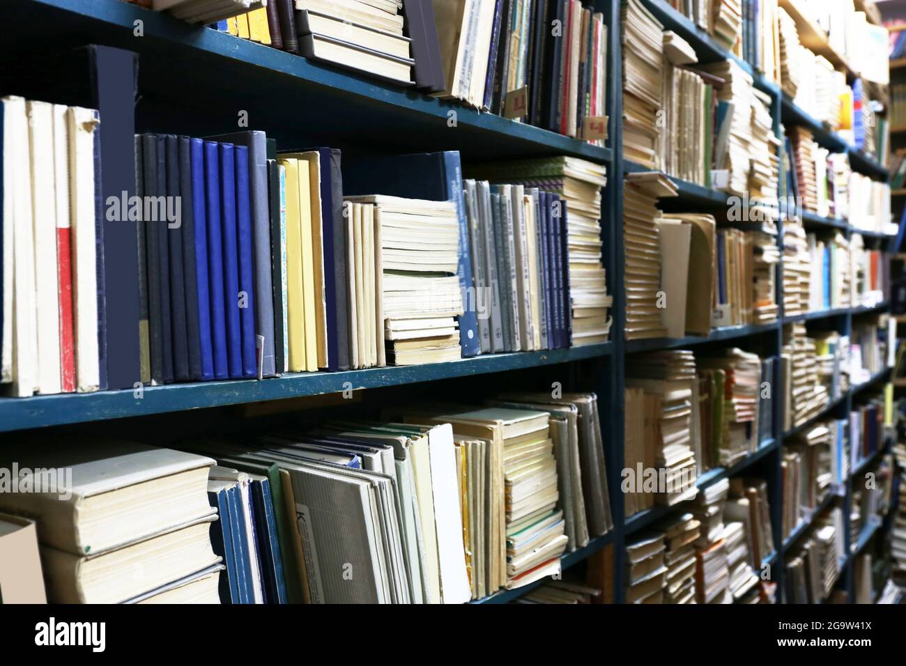 Many books on bookshelf in library Stock Photo - Alamy