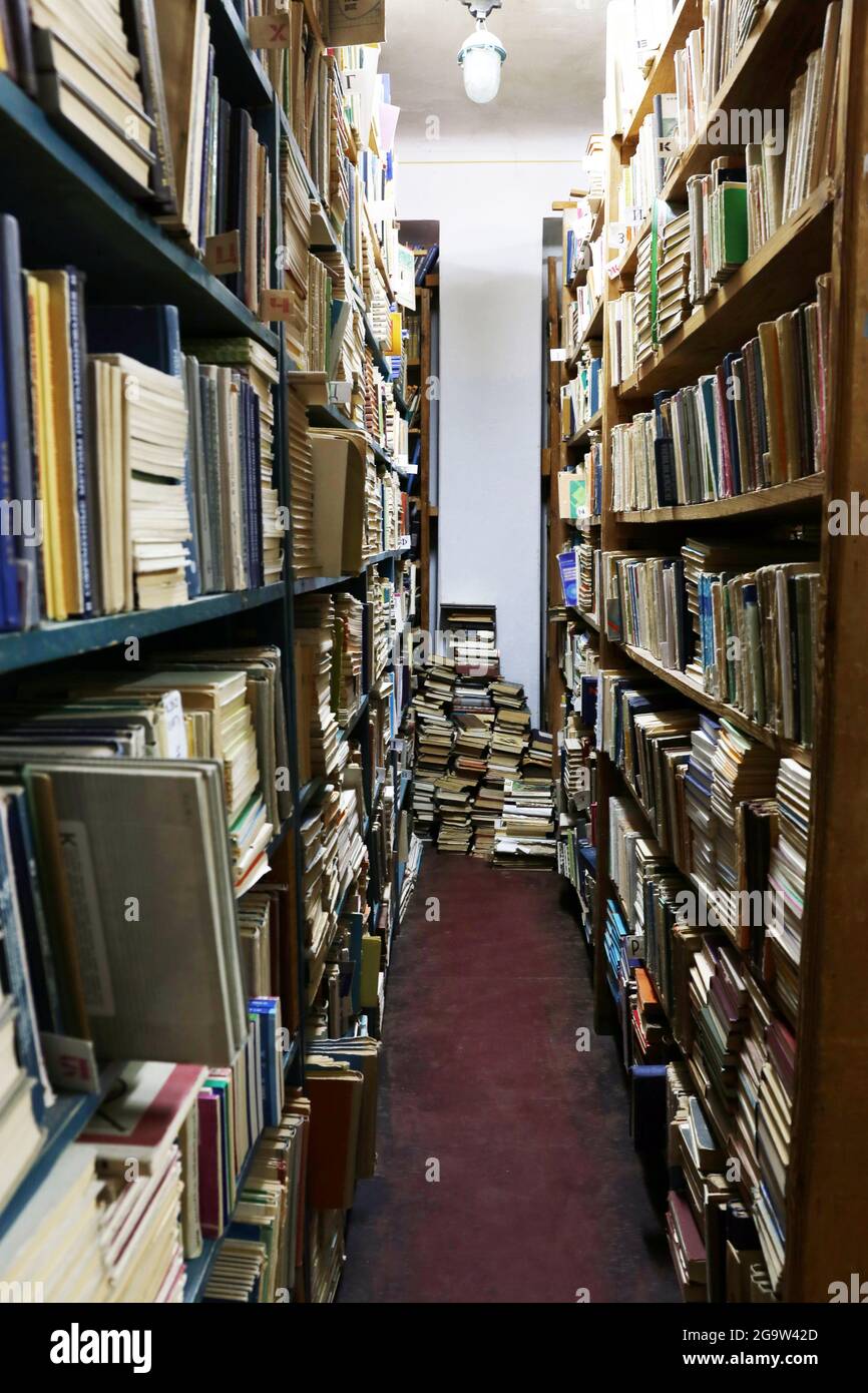 Many books on bookshelf in library Stock Photo - Alamy