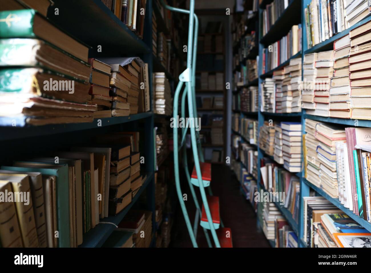 Many books on bookshelf in library Stock Photo - Alamy