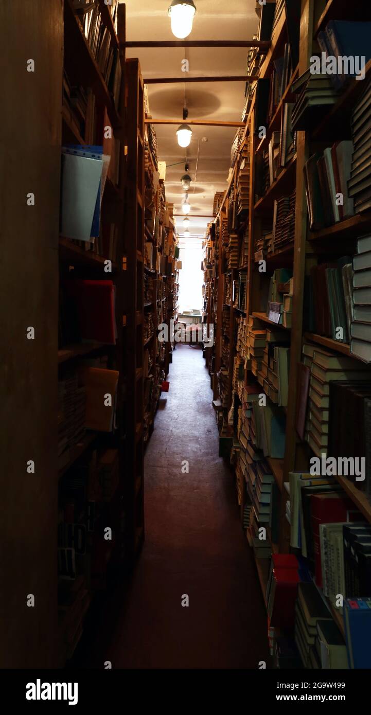 Many books on bookshelf in library Stock Photo - Alamy